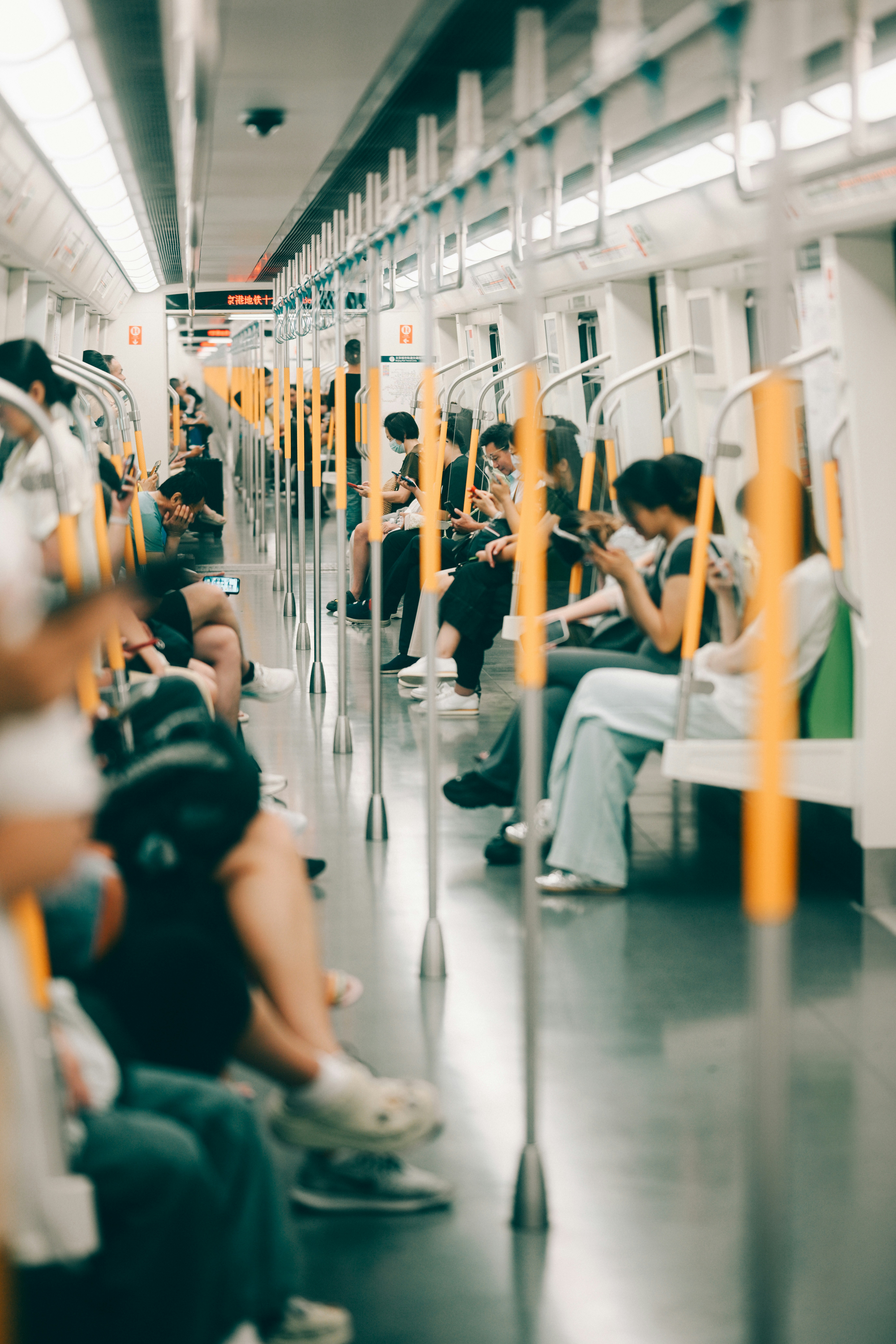 Passengers in a Modern Subway Car: Quiet Moments Between Commuters
