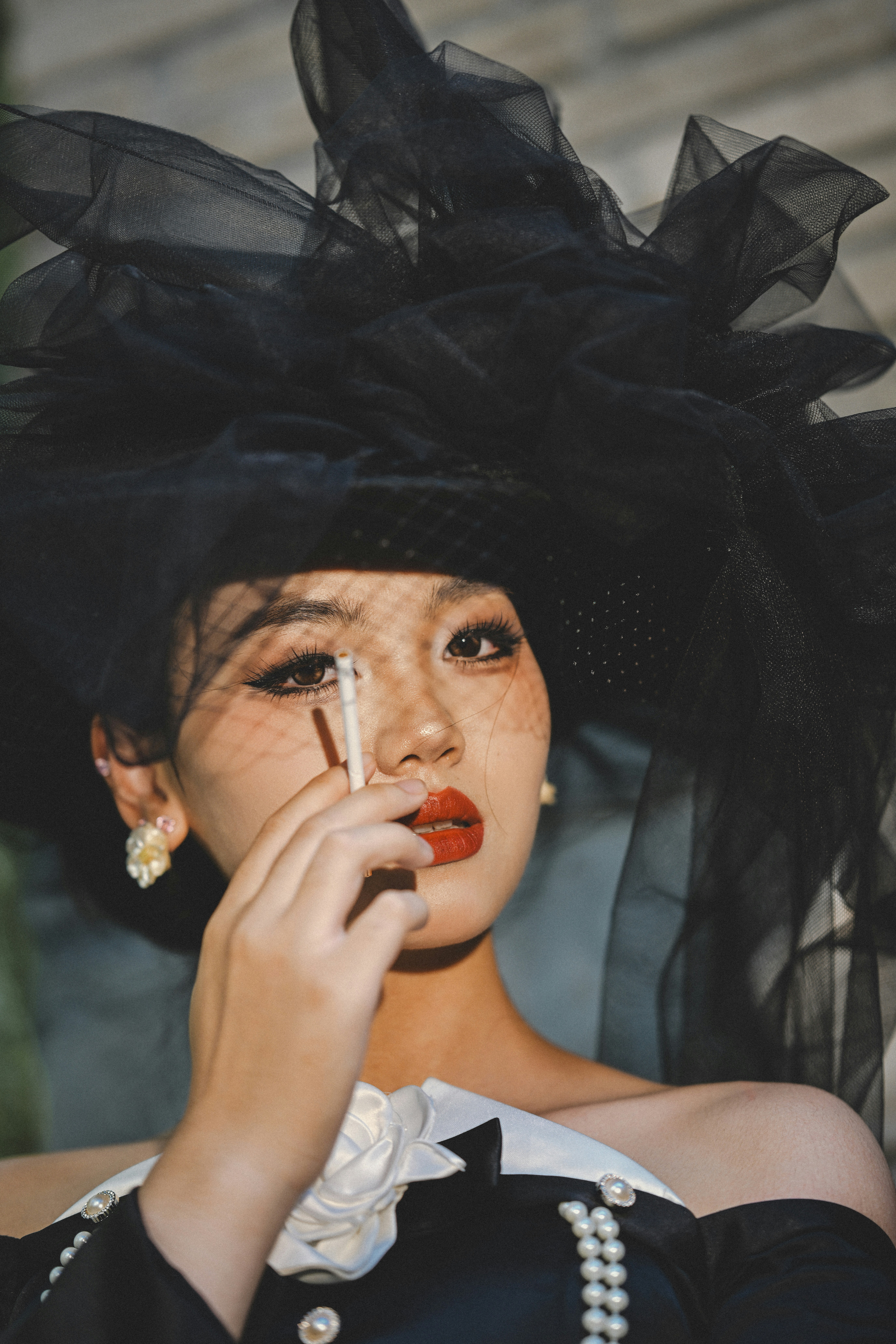 Veiled Glamour: A Portrait of Shadow and Lip