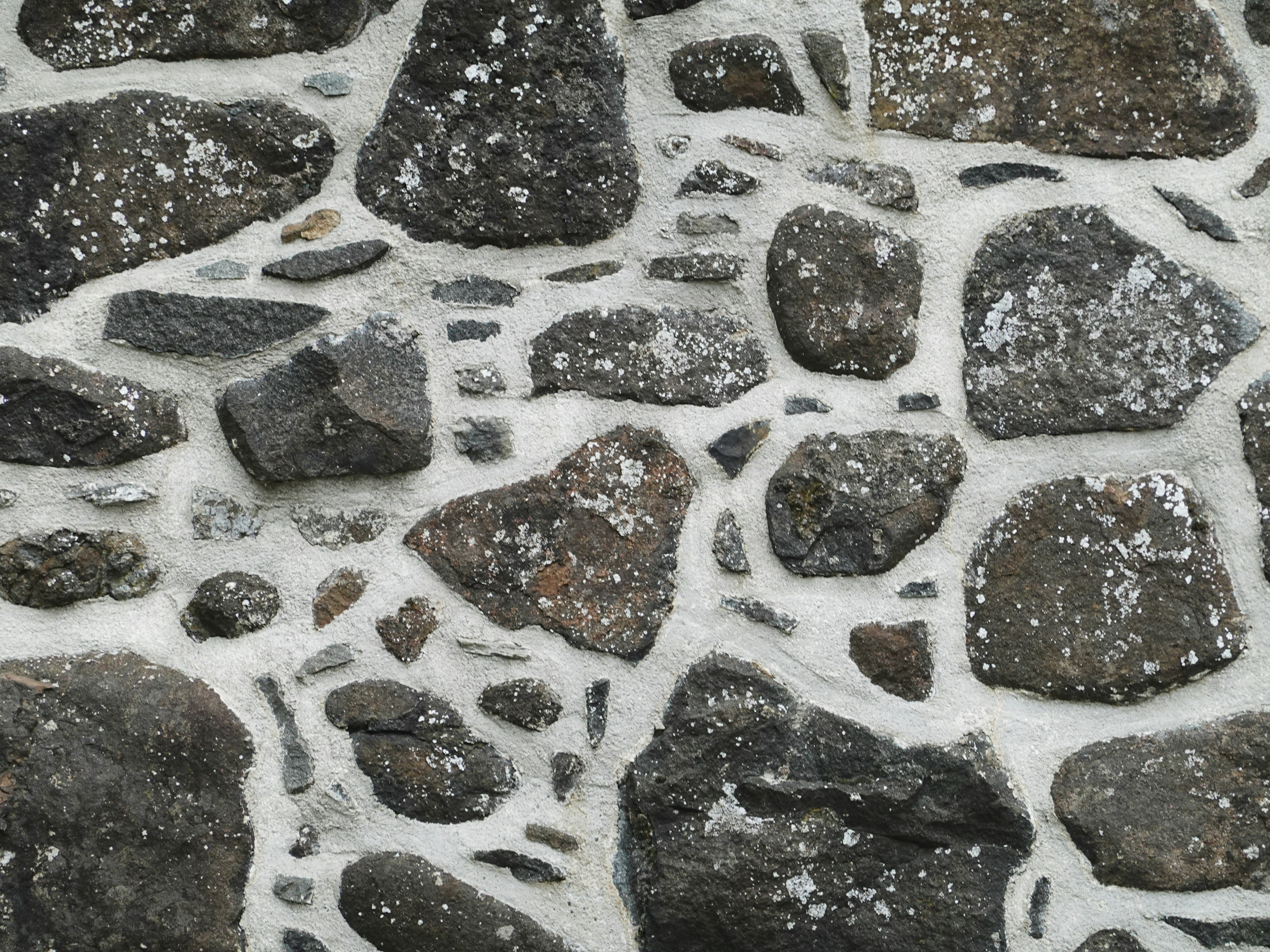 Pebbled Mosaic: Granite Stones Framed by Powdered Mortar