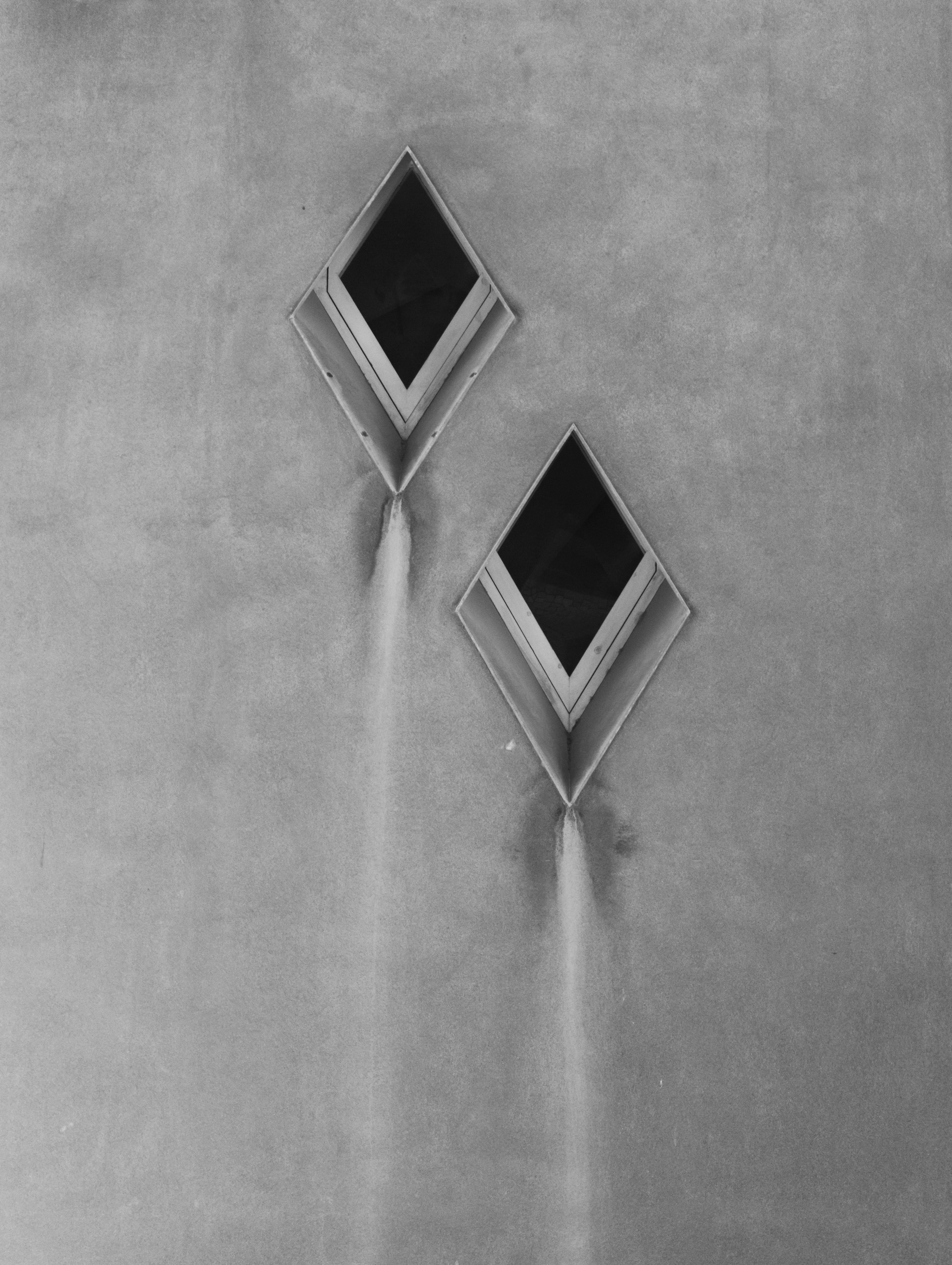 Vertical Echoes: Diamond Windows on a Concrete Veil
