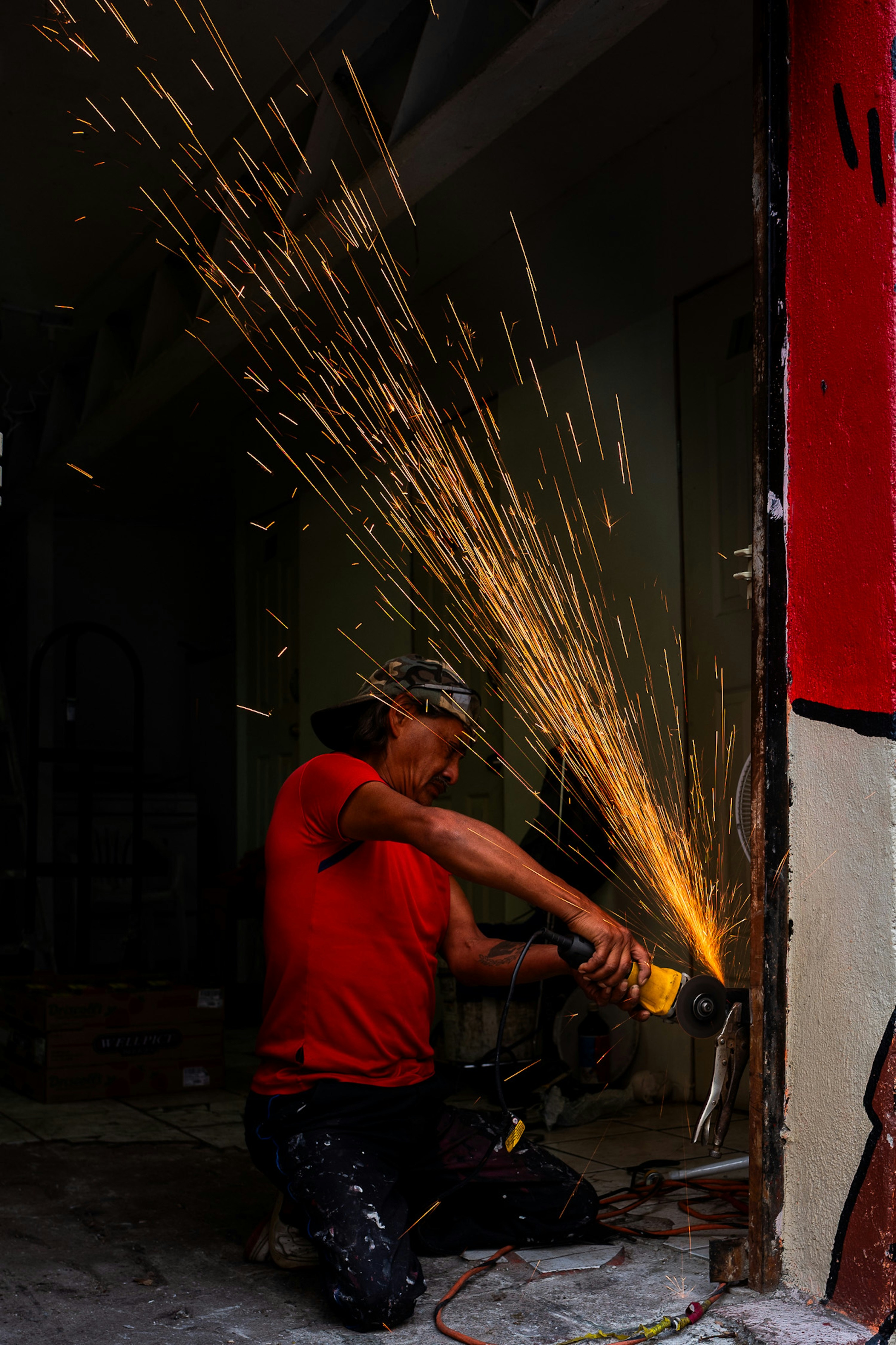 Sparks in a Red Workshop: A Builder’s Moment of Fire and Focus