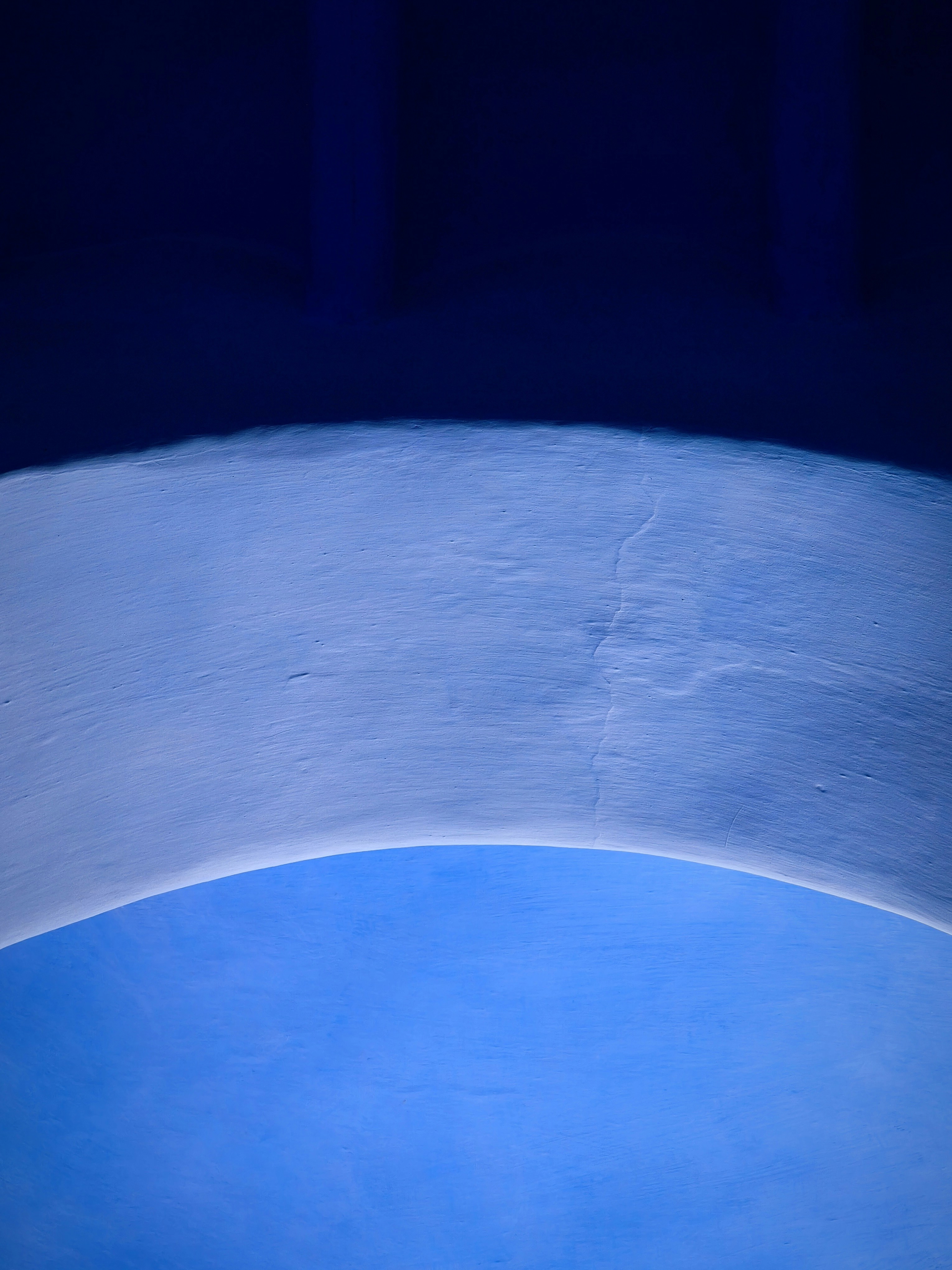 Blue Curve: A Quiet Play of Light on Arch and Wall