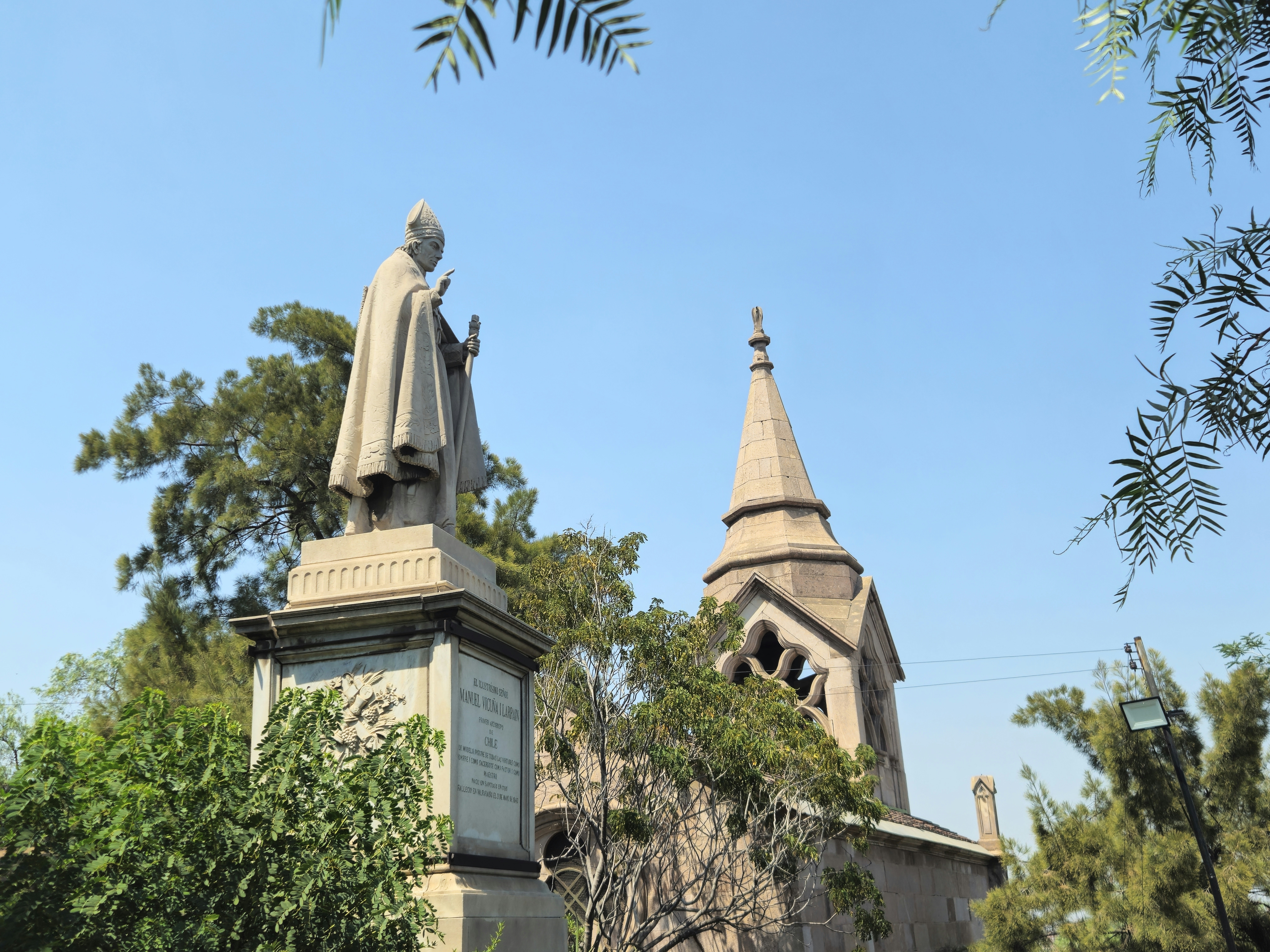 Statues and Spire: Quiet Reverence under a Blue Sky