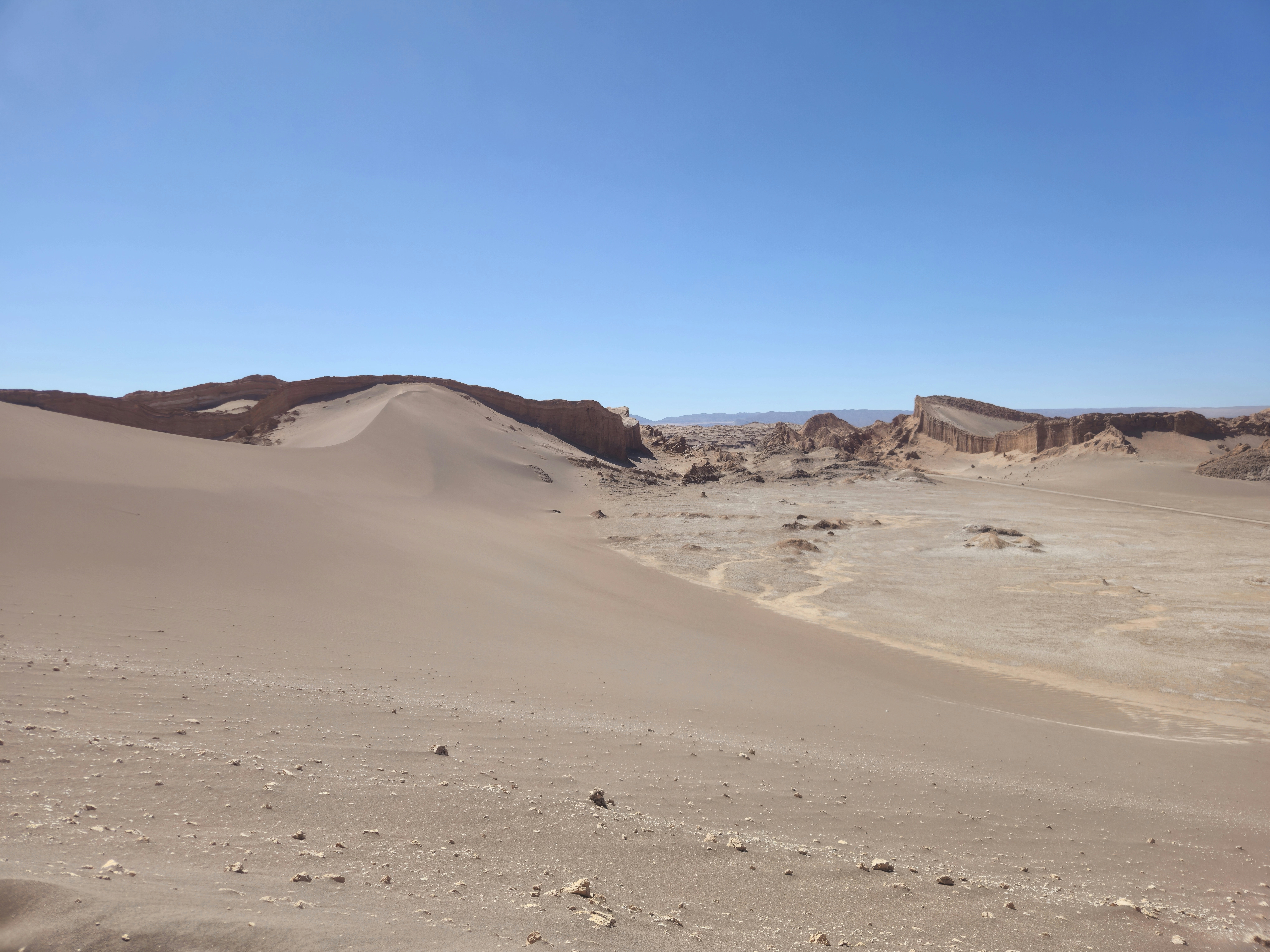 Midday Dune Crest under a Clear Blue Arc