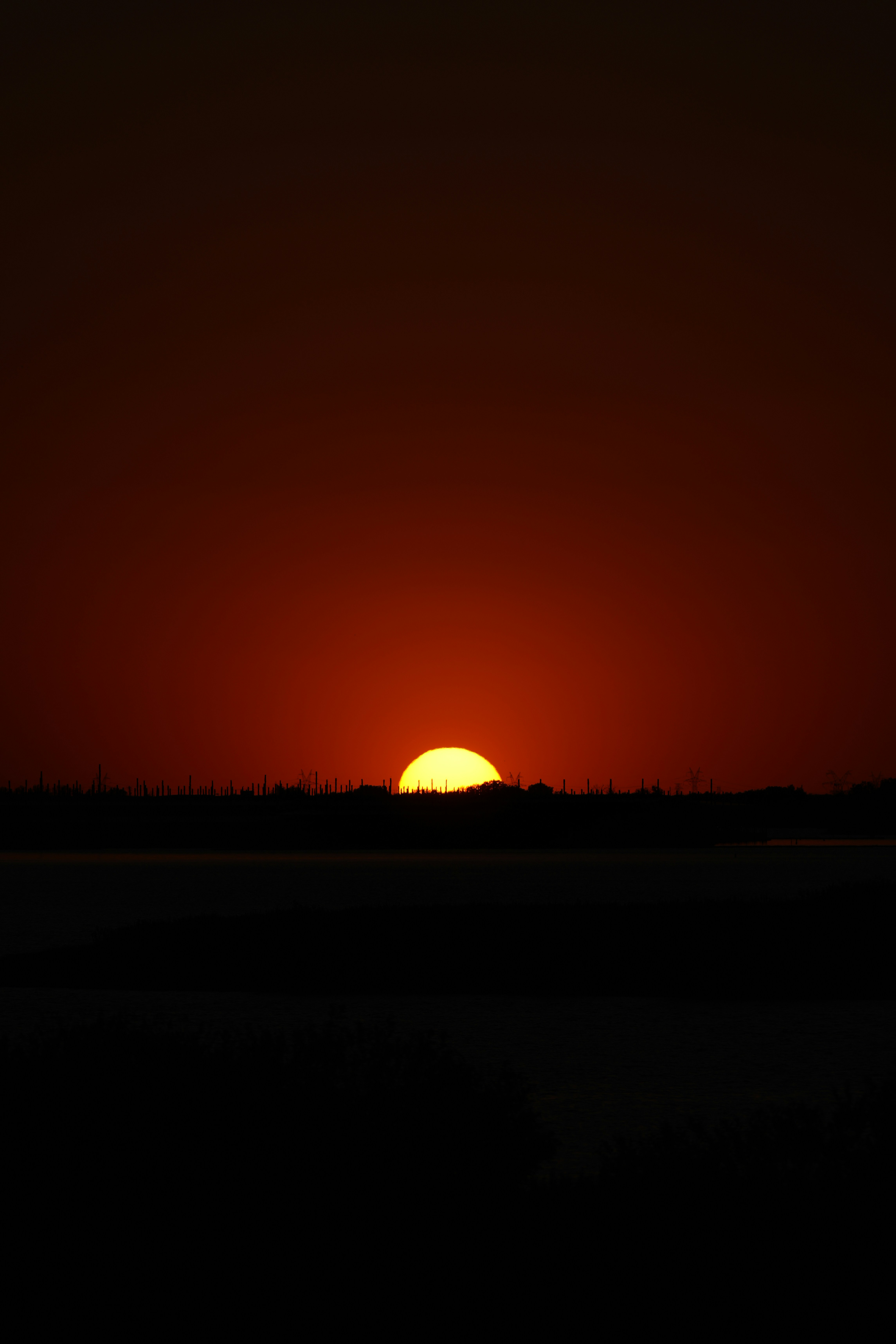 Dim Glow on the Horizon: Sunset Seascape at Dusk