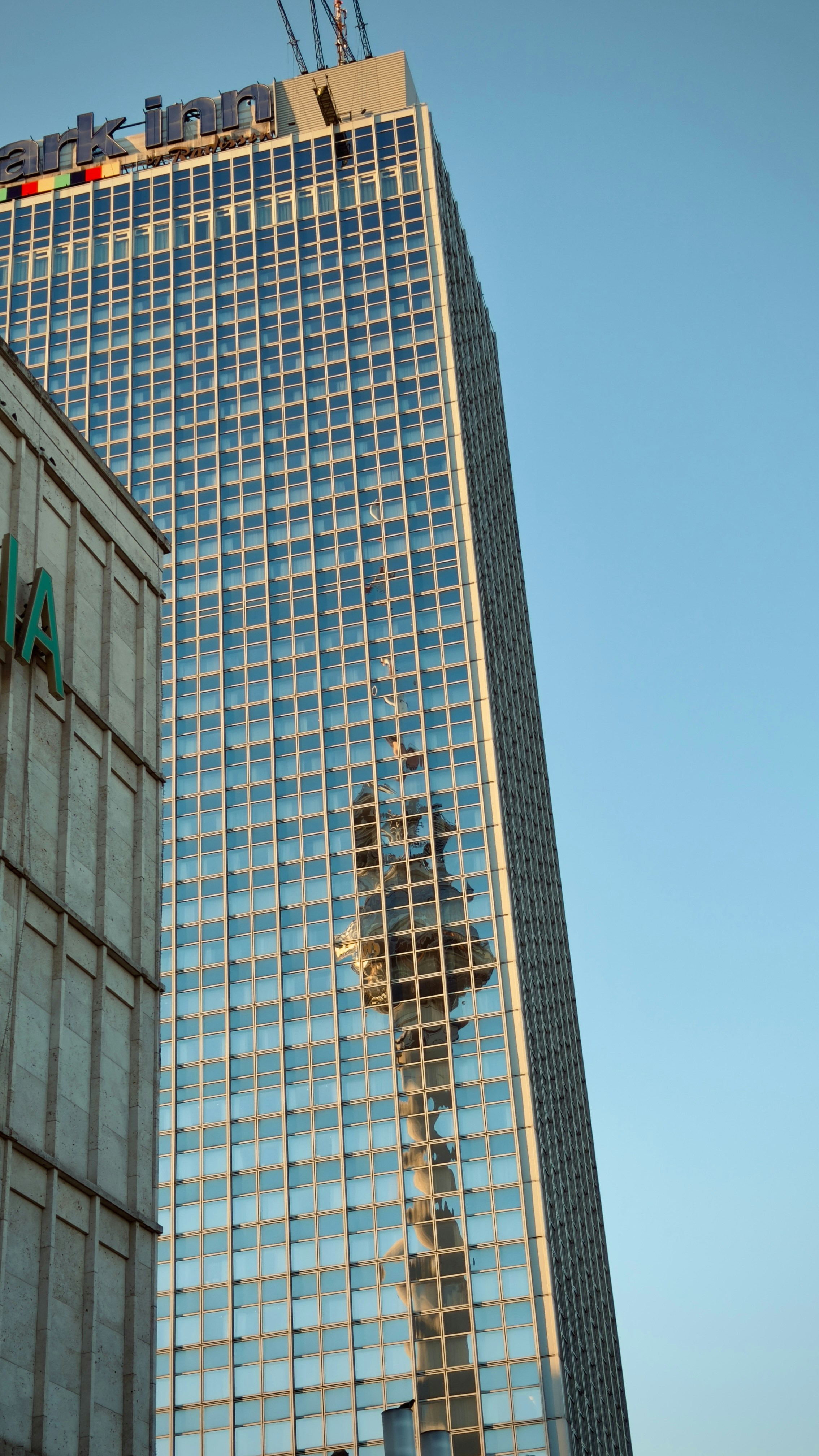 Titanium Facade: A Skyscraper Reflecting the Sky