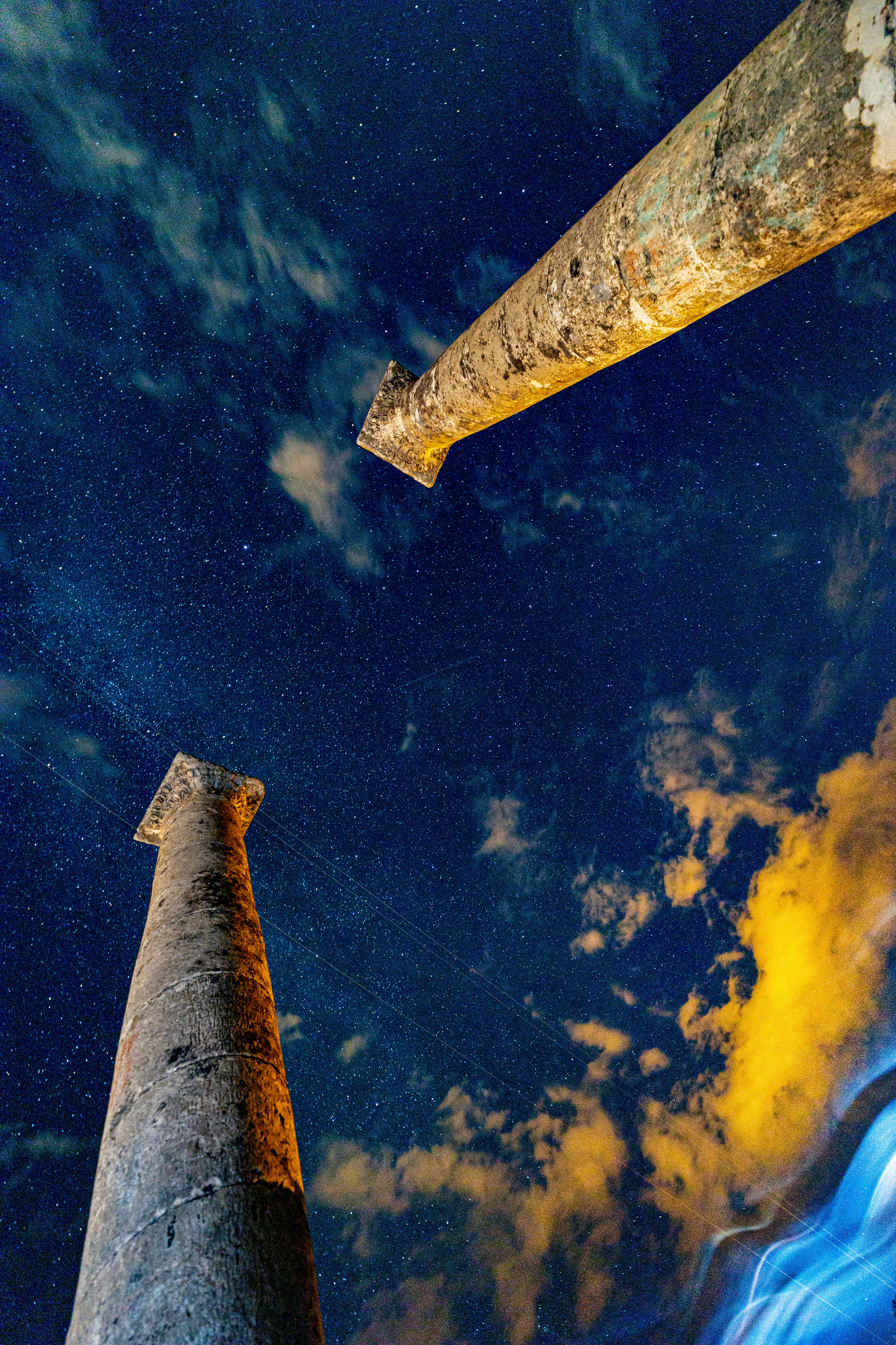 Rusted Pillars under a Starry Night Sky