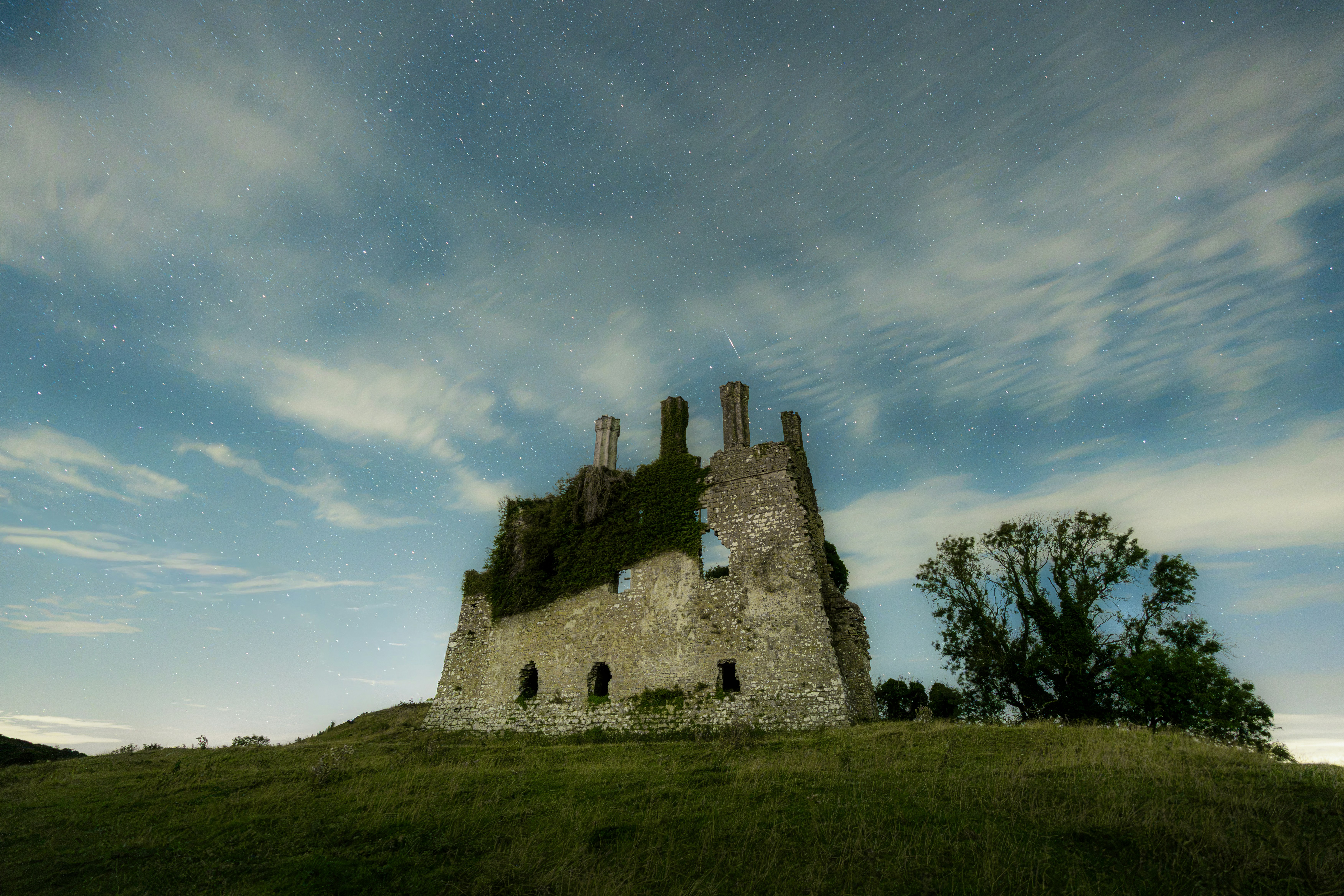 Moonlit Ruins: A Lone Fortress Beneath a Starry Veil