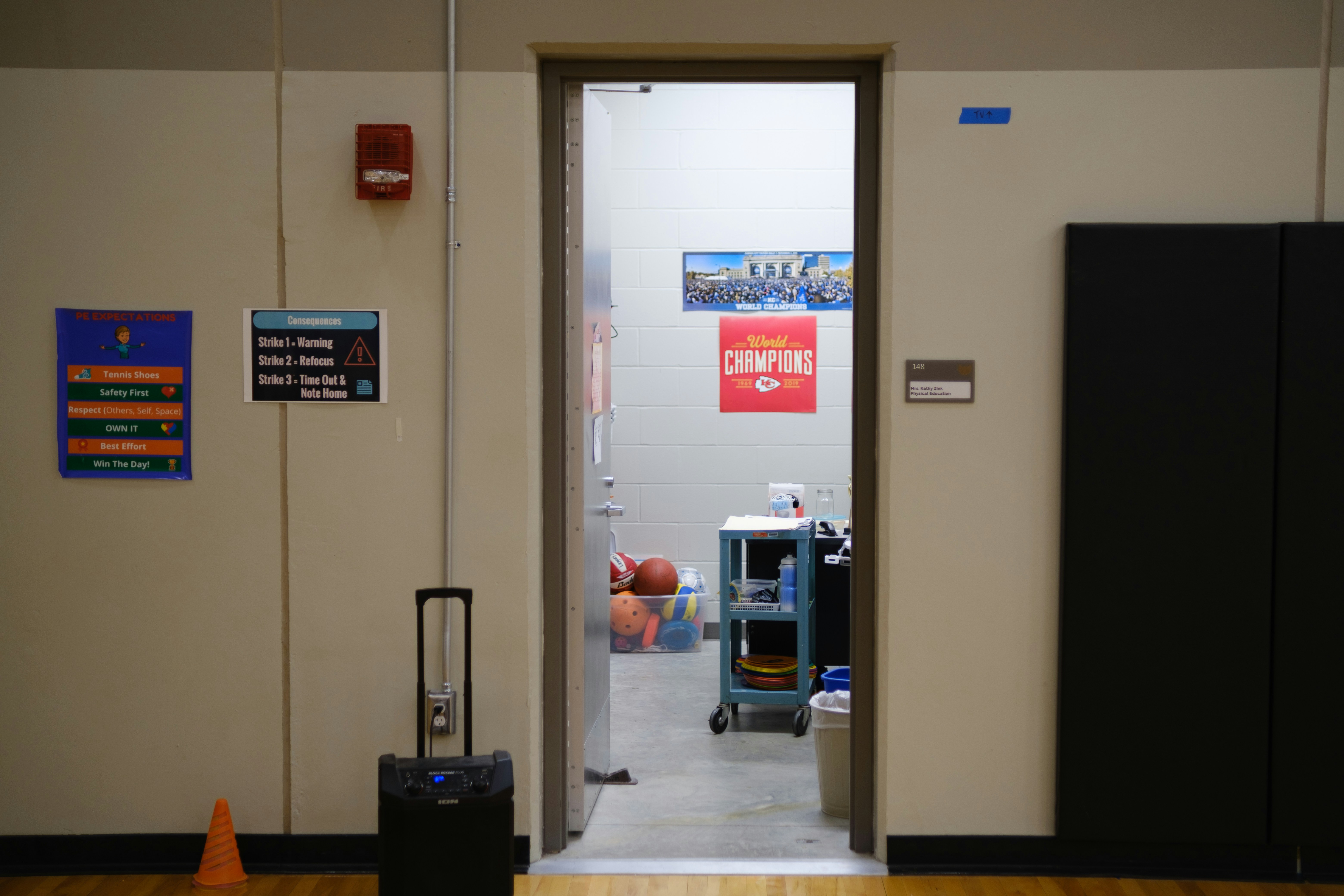 Doorway to the Backroom: A Gym Corridor with Equipment
