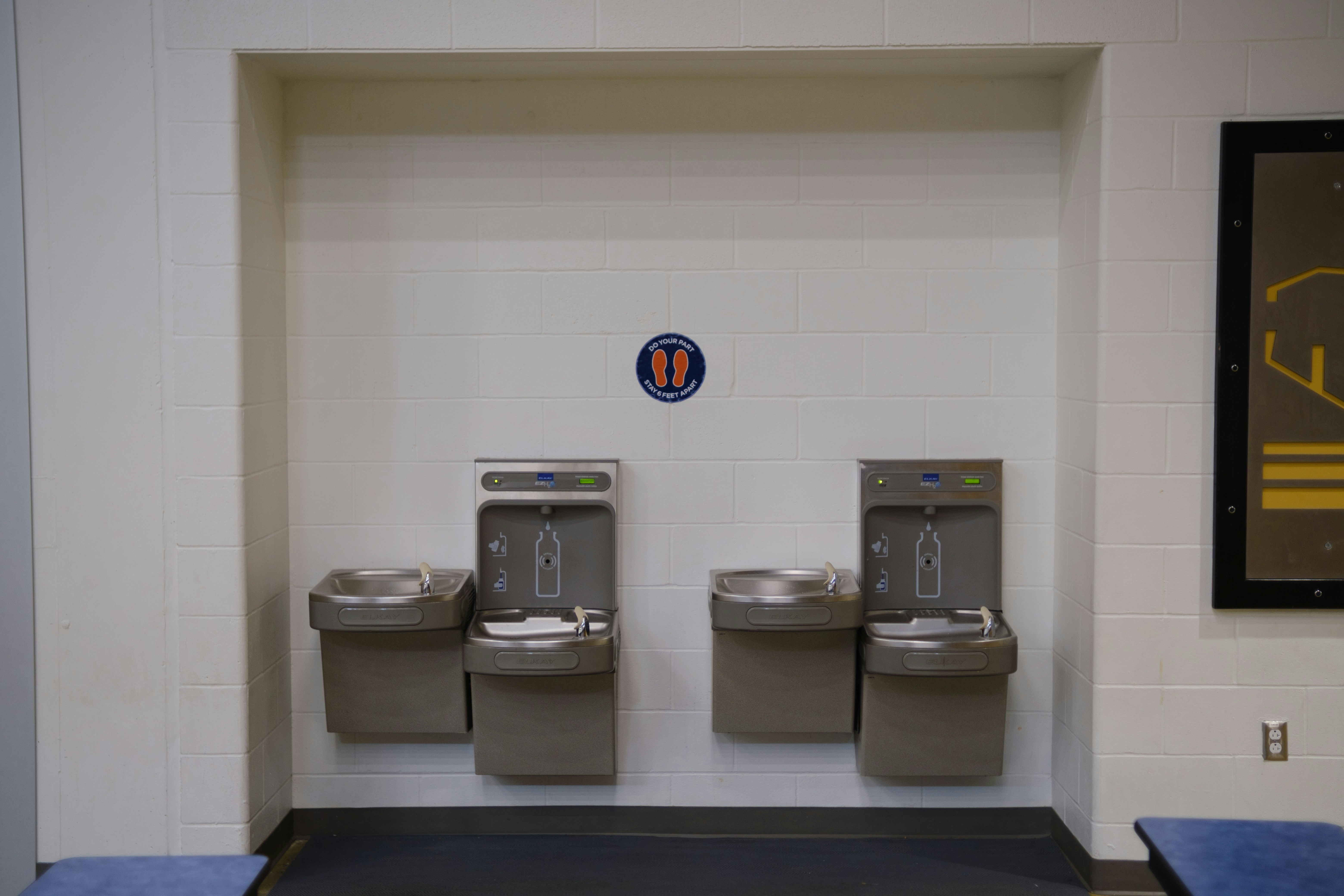 Symmetrical Water Stations Under a Quiet Arcade