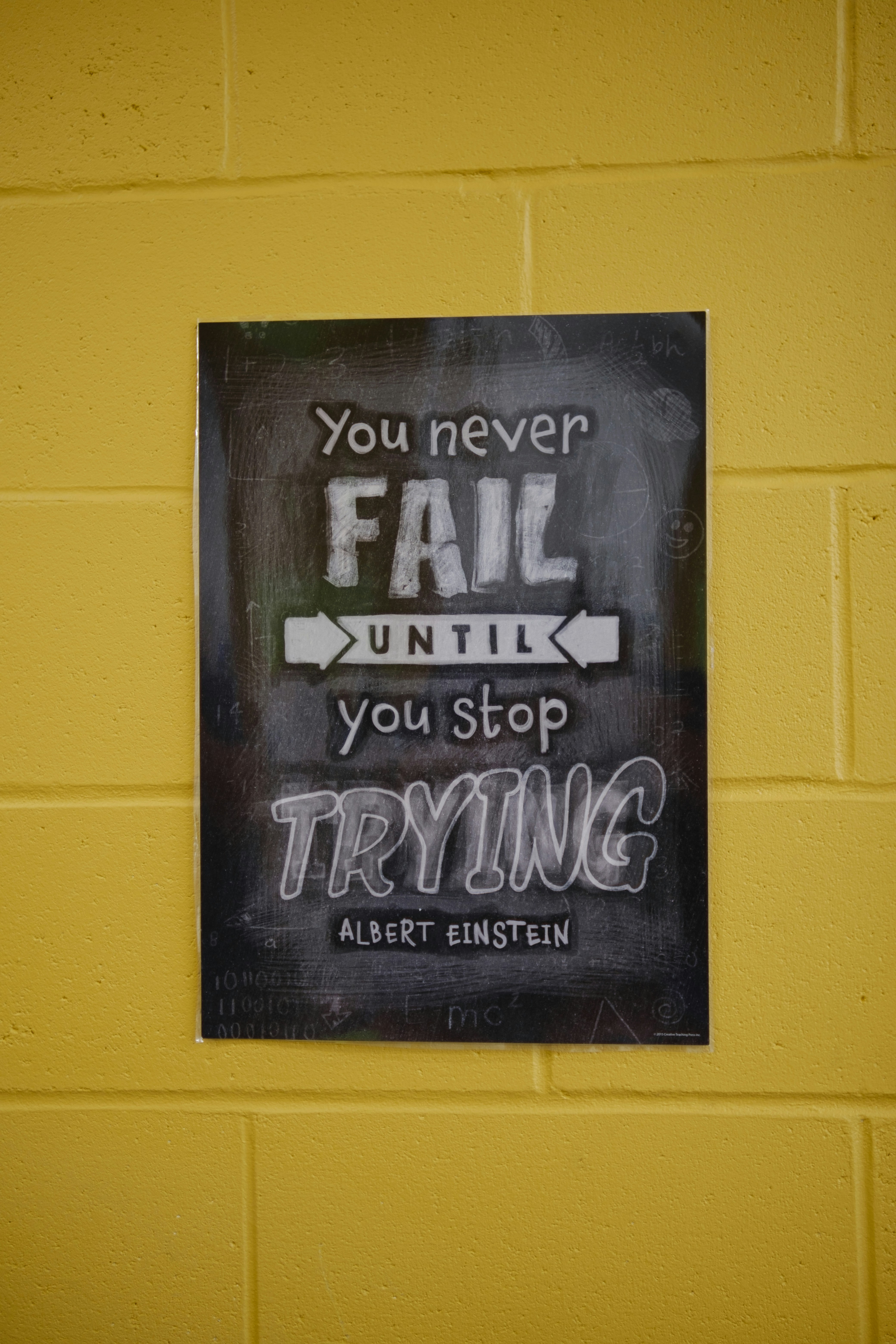 Chalkboard Wisdom on a Bright Yellow Wall