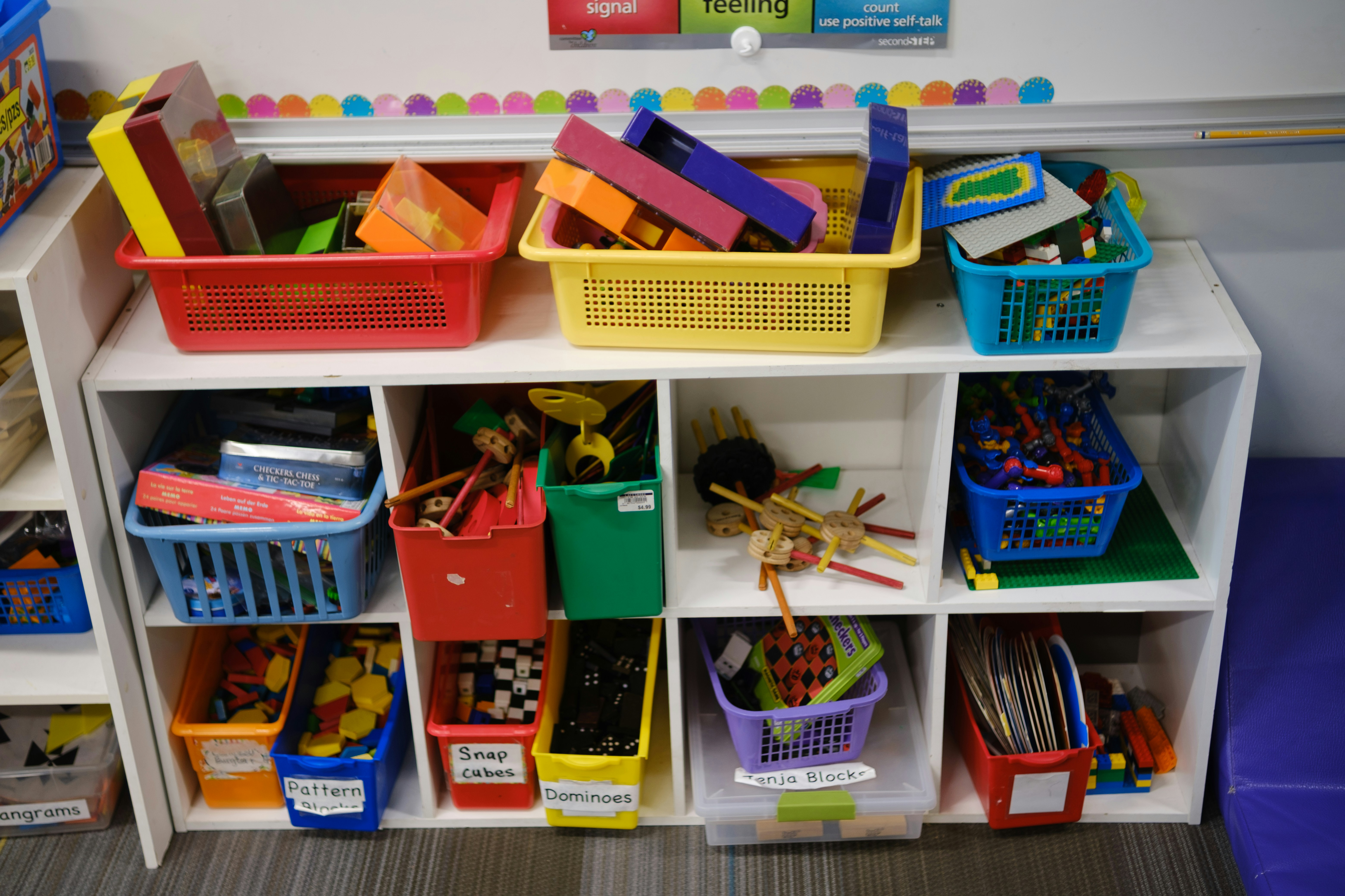 Colorful Craft Corner: A Wall of Bins Filled with Toy Blocks and DIY Materials