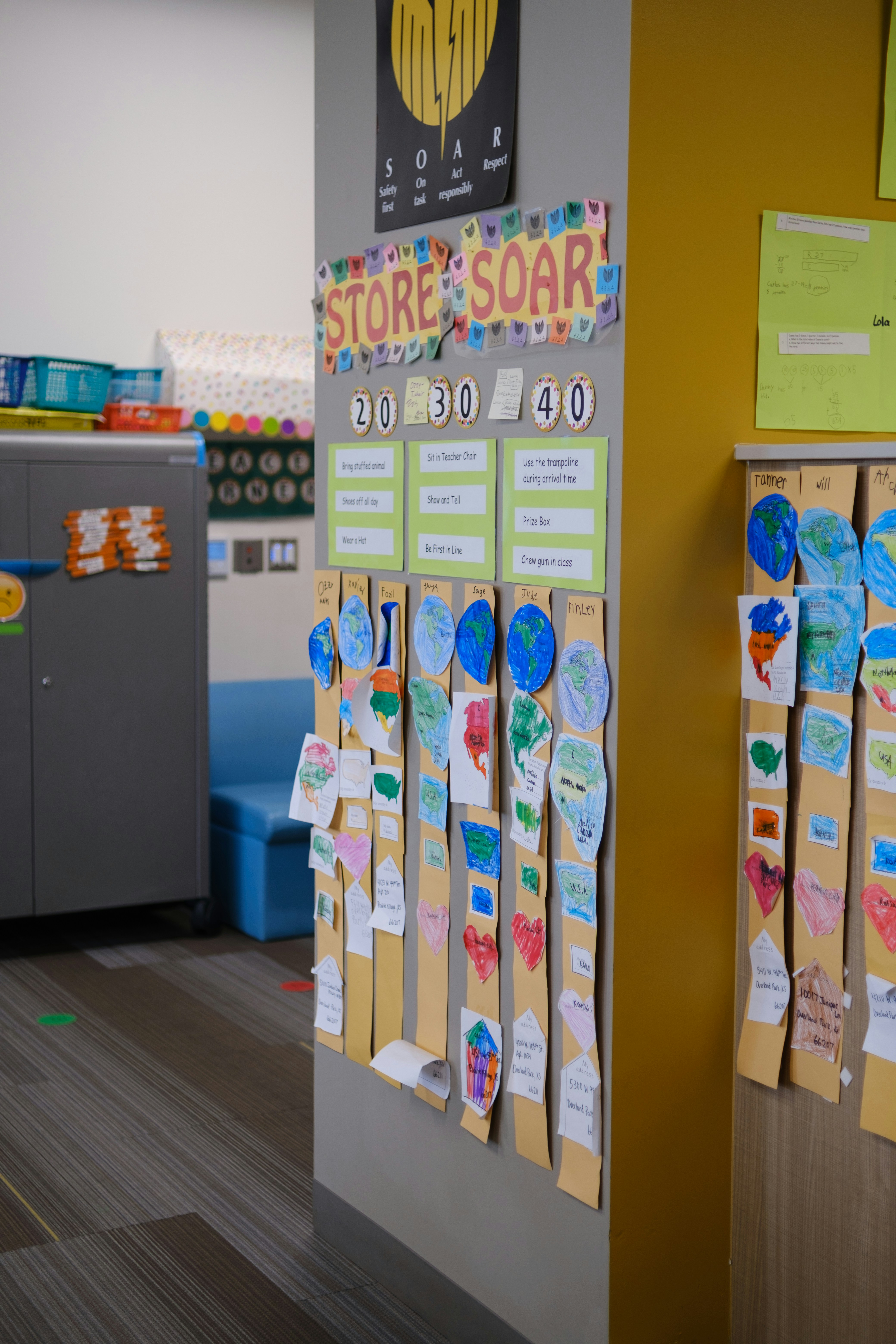 Soaring Storefront: A Wall of Student Creations and a Bright Yellow Accent Wall