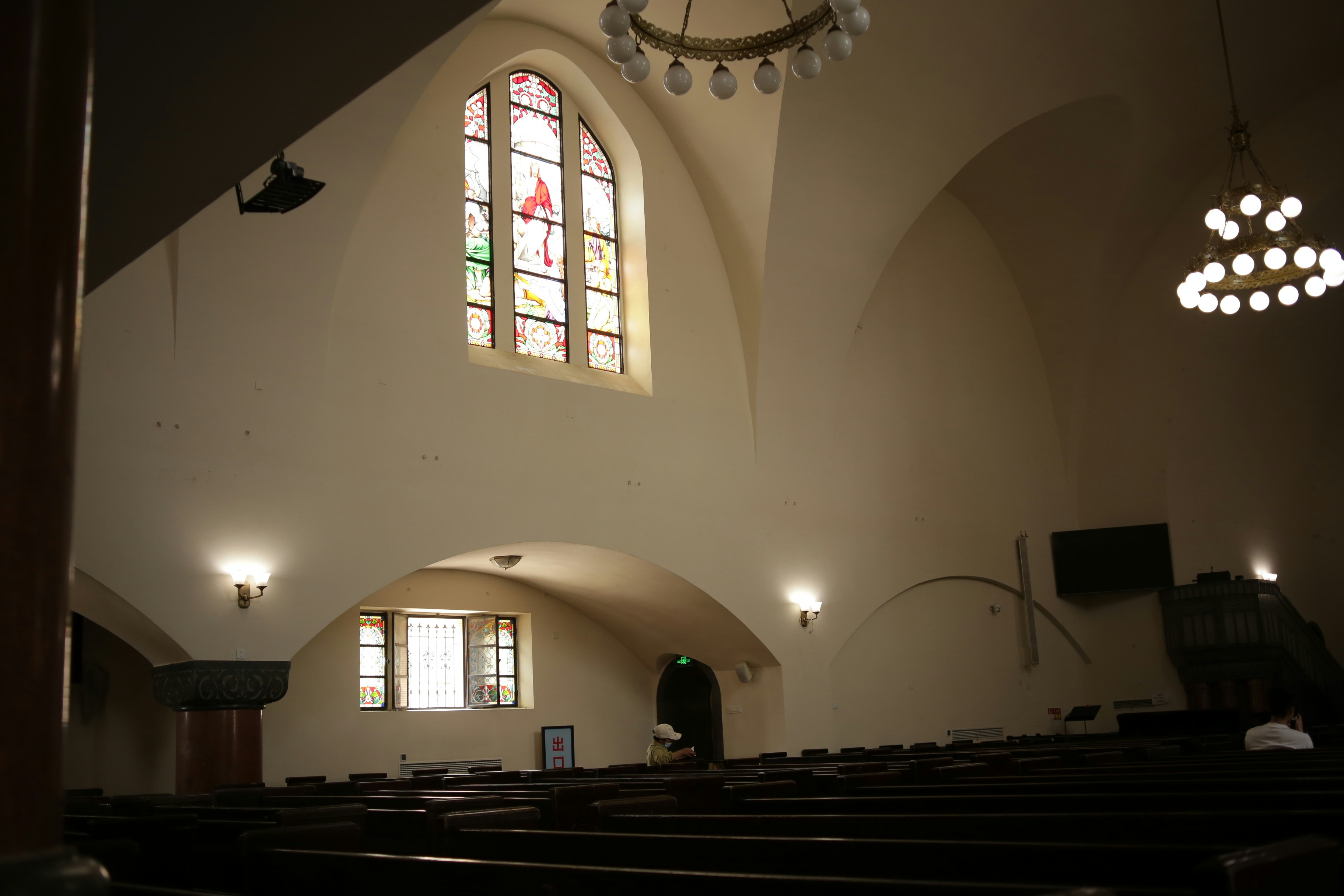 Softly Lit Aisle: A Quiet Sanctuary Within the Church