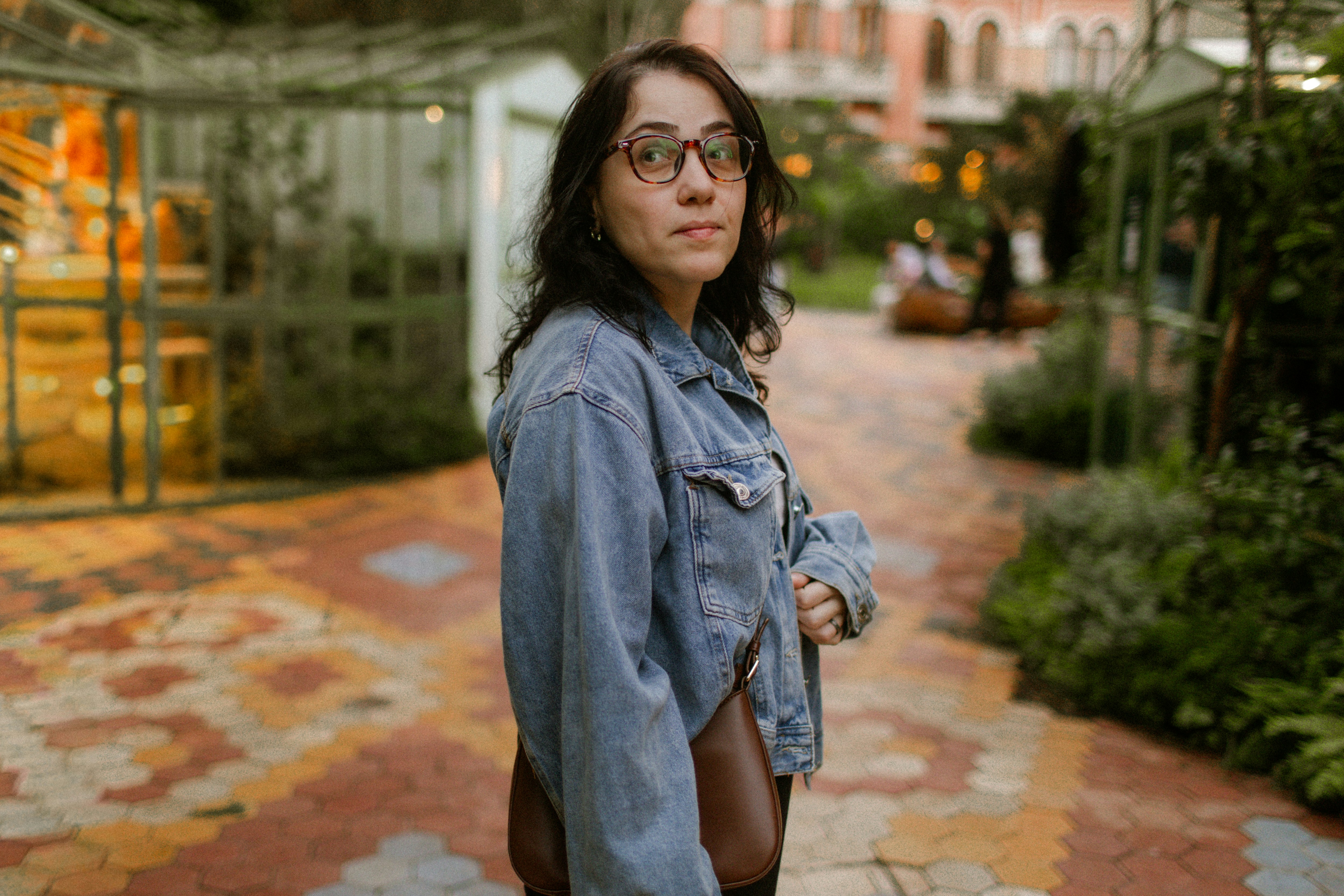 Denim-clad Portrait in a Courtyard Arc