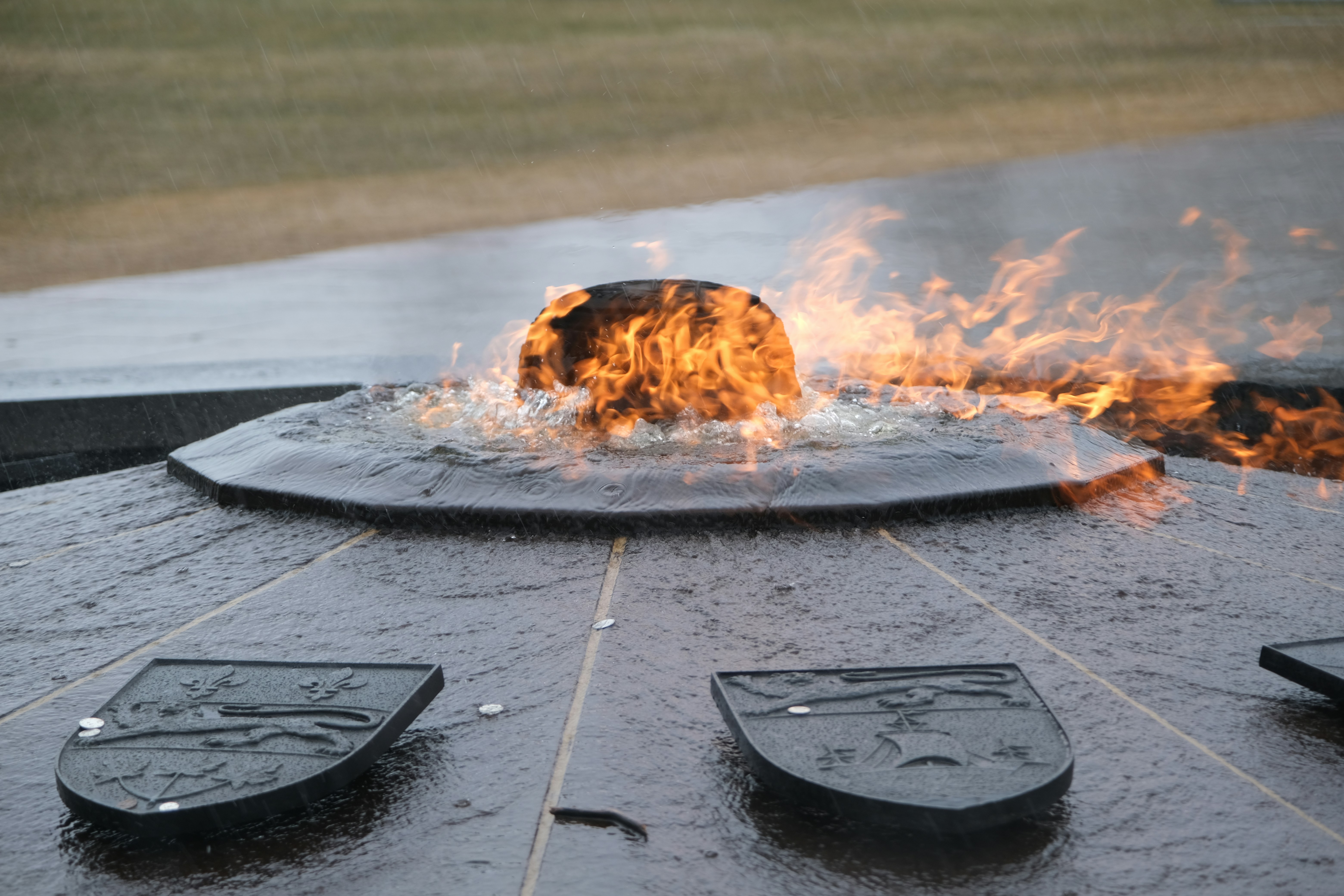 Inferno on the Pedestal: Eternal Flame Surrounded by Dark Granite