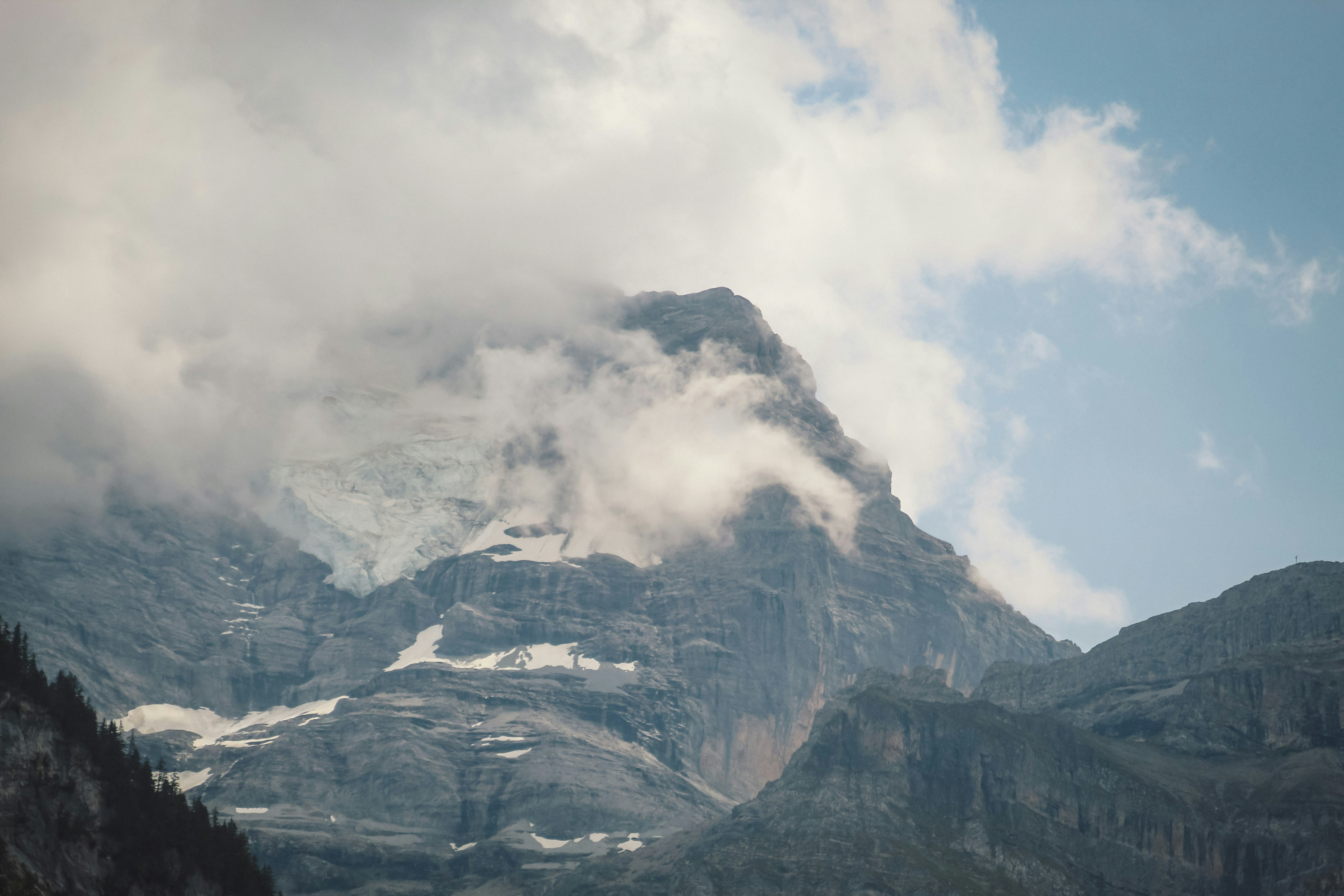 Clouds Embrace a Rigid Peak