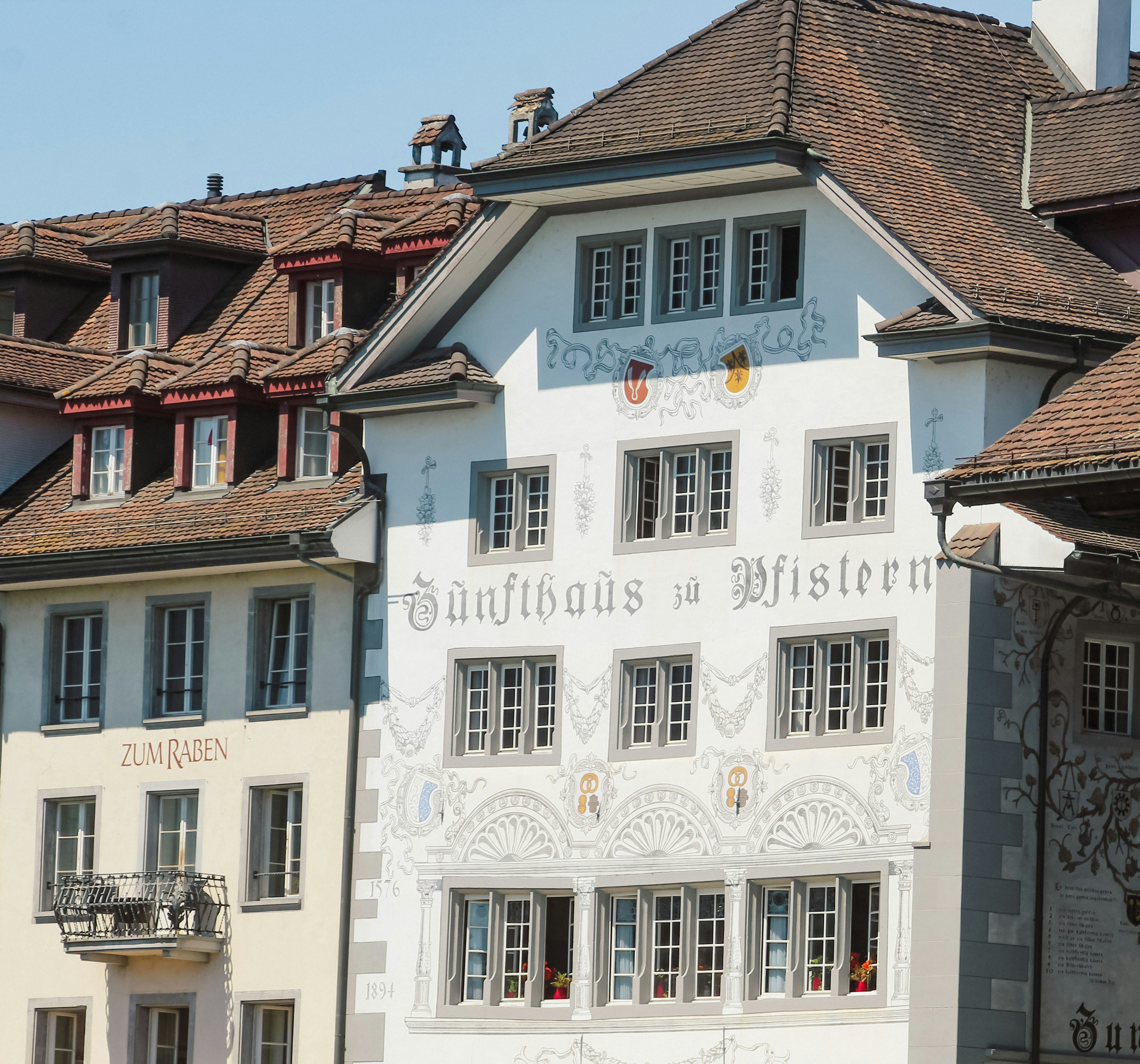 Ornate Facade, Alpine Light: A Swiss-Gothic Town House in Soft Morning Sun