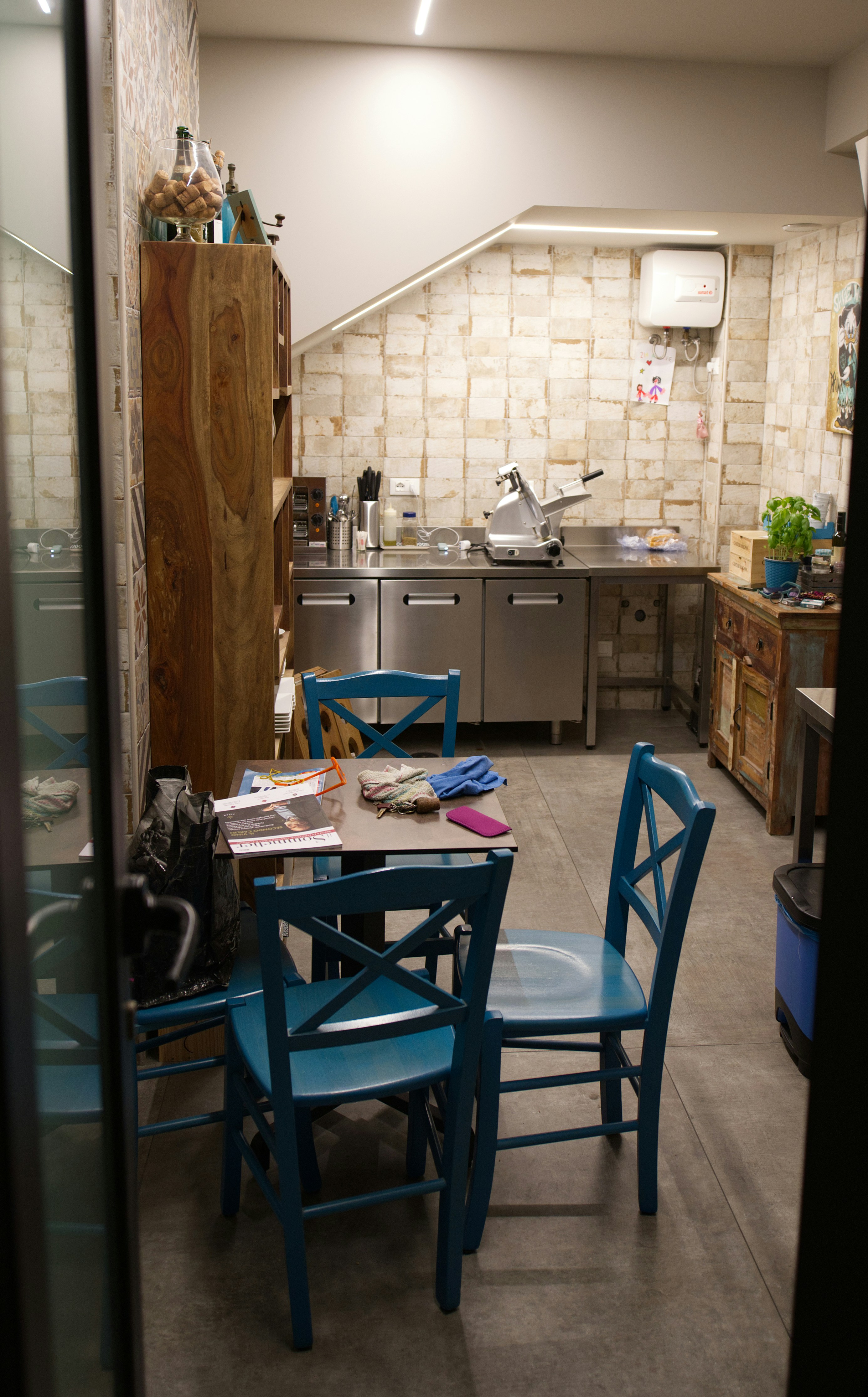 Blue Chairs, Warm Kitchen: A Cozy Café Corner in motion