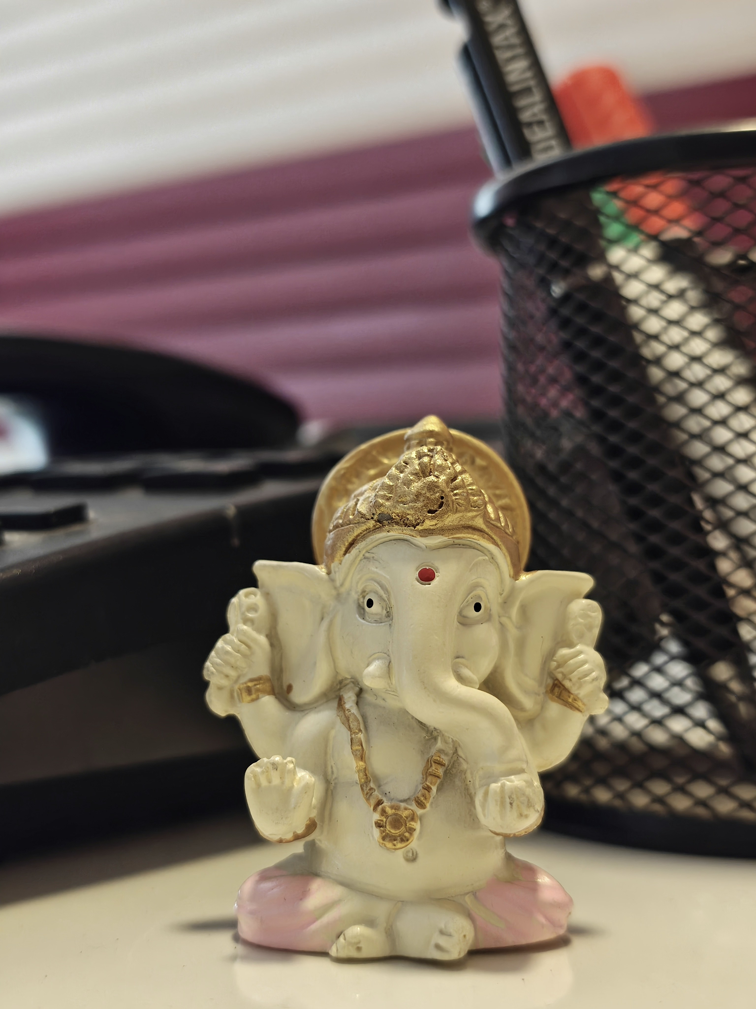 Tiny Ganesha, Big Focus: A Ceramic Idol on a Desk