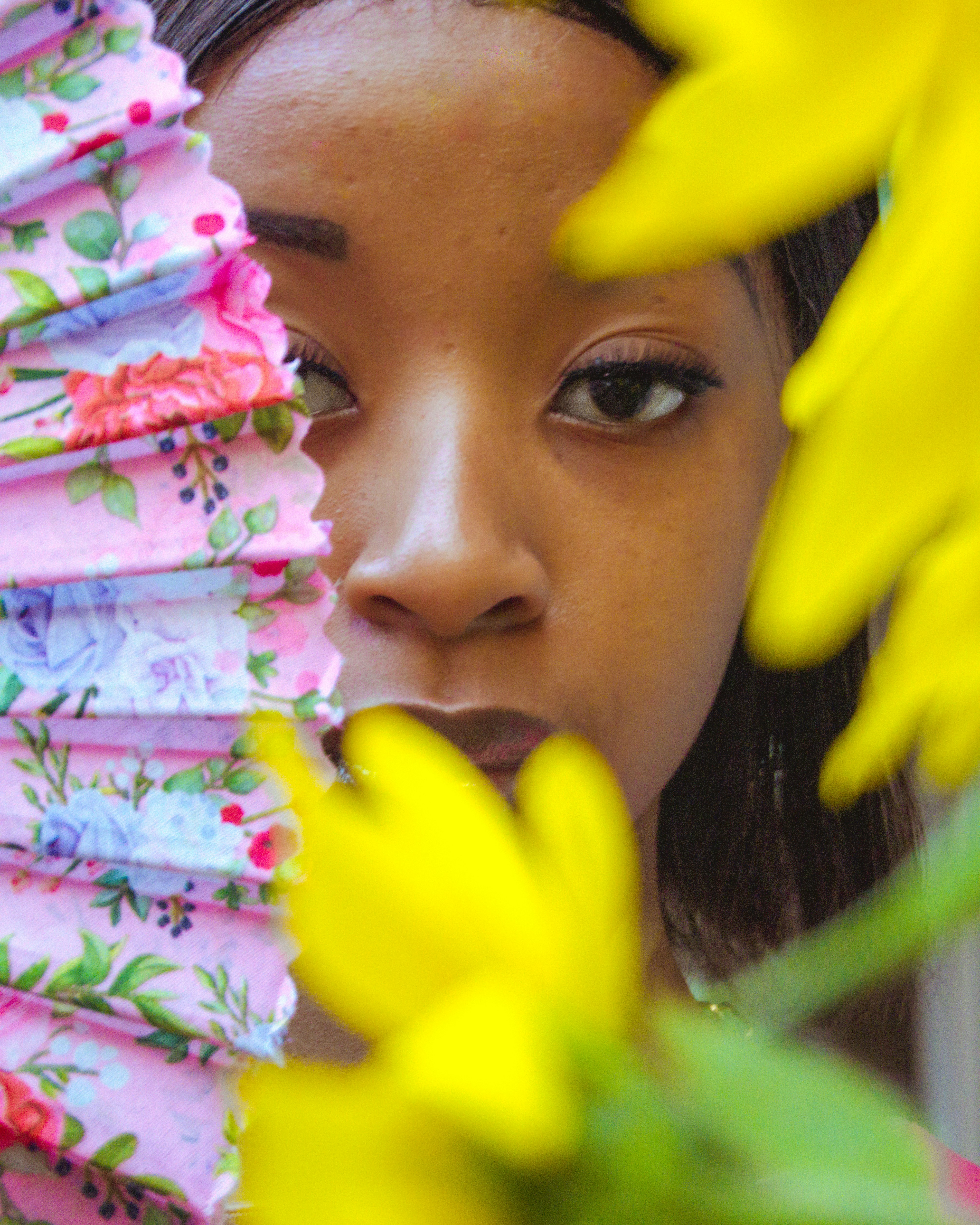 Portrait of a Hidden Smile: Framed by Floral Fold and Sunlit Yellow Petals