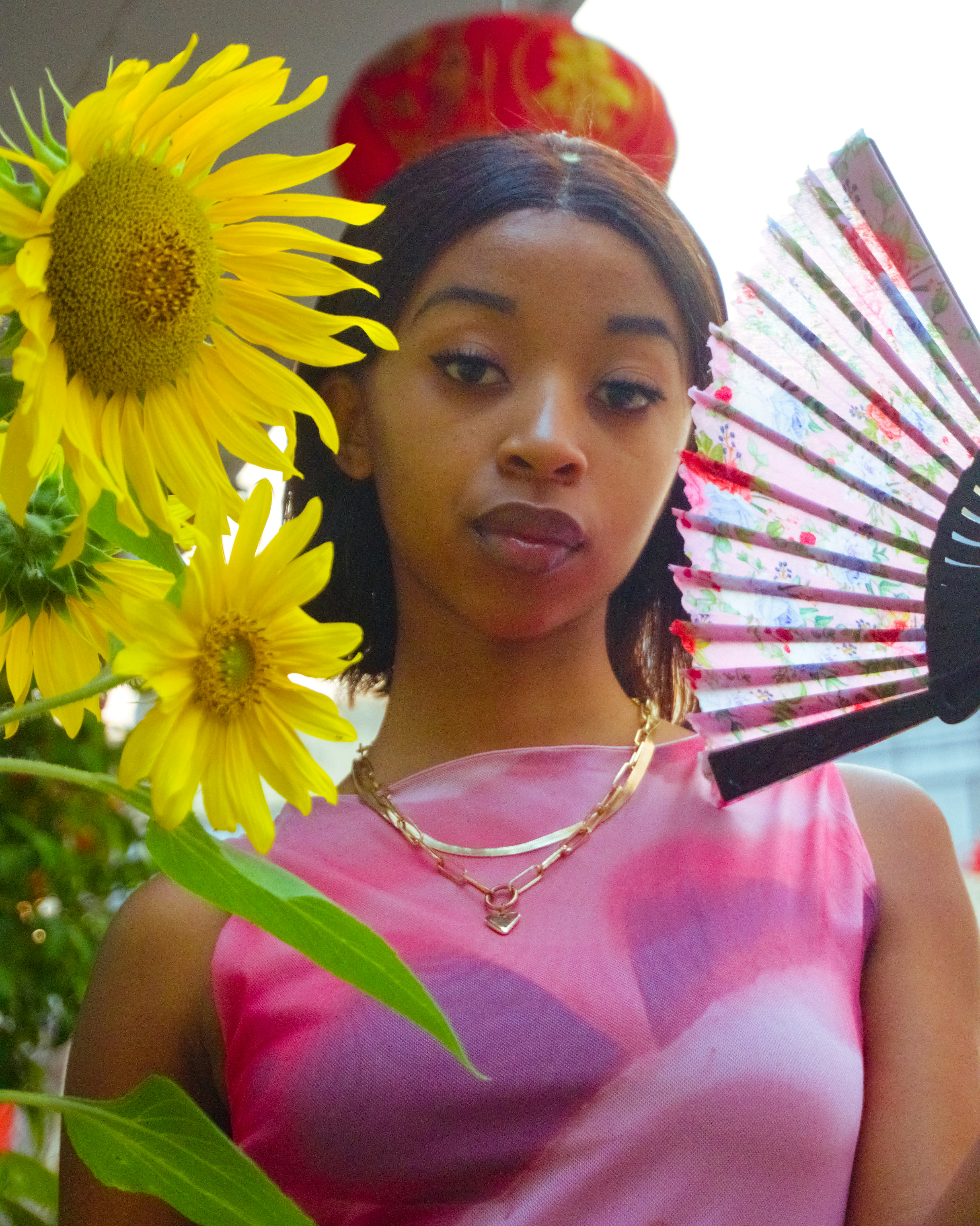 Sunflower Portrait Under Colorful Fan and Red Lanterns