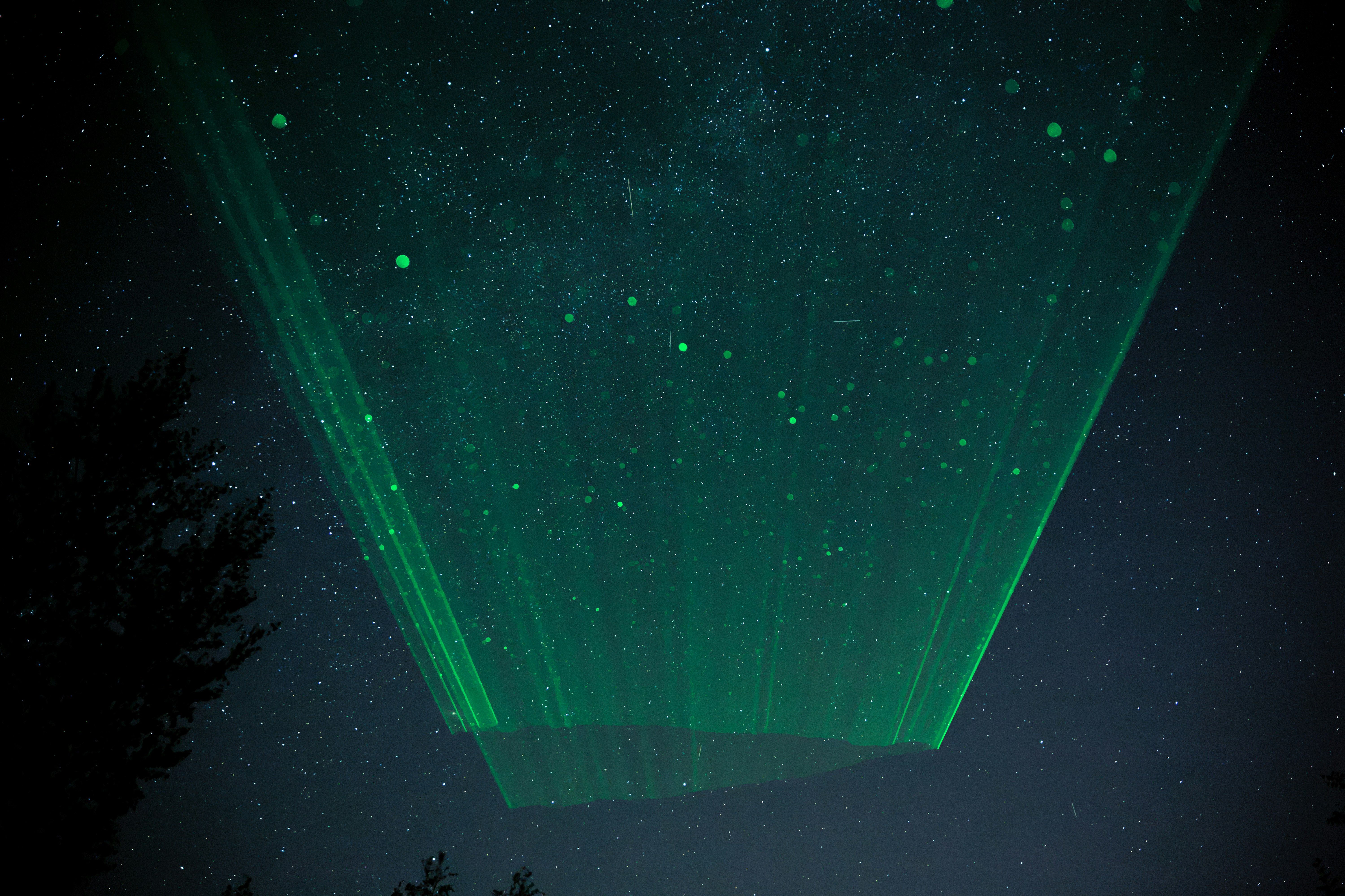 Green Laser Cathedral: A Night Sky Illuminated by Geometry