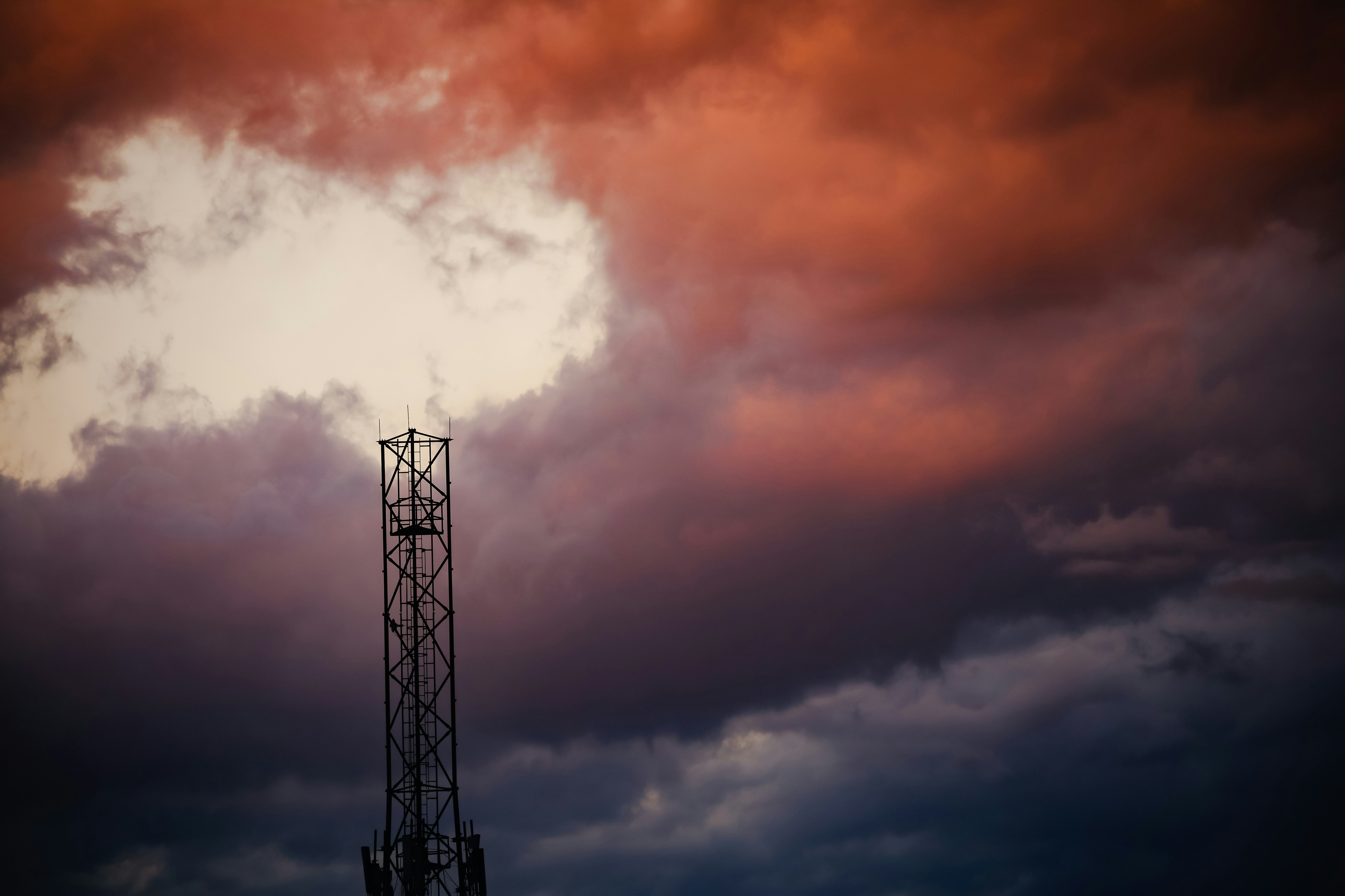Midnight Signal: A Tower Against a Dramatic Painted Sky