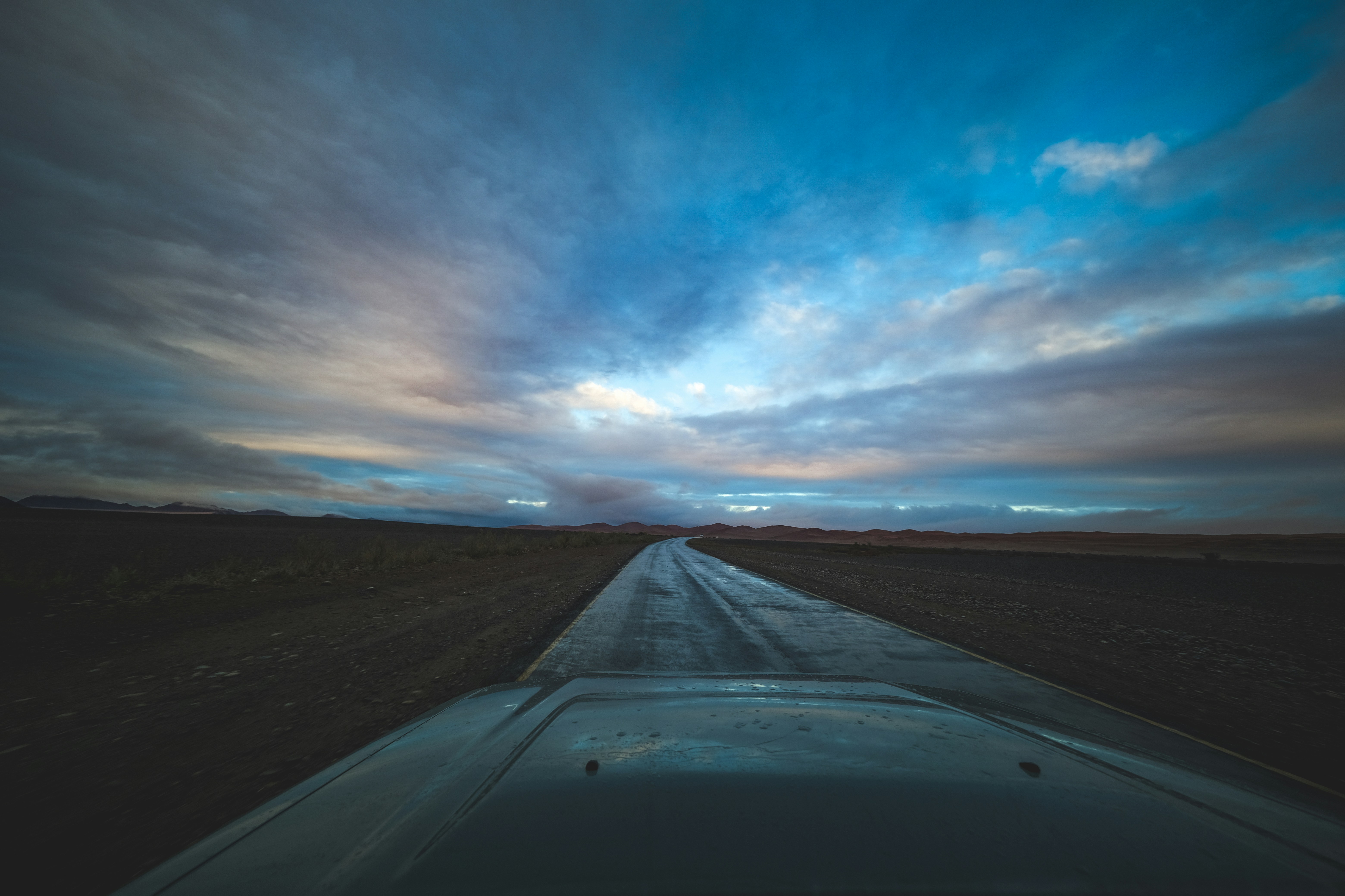 Toward the Quiet Horizon: A Wet Road Toward Distant Light