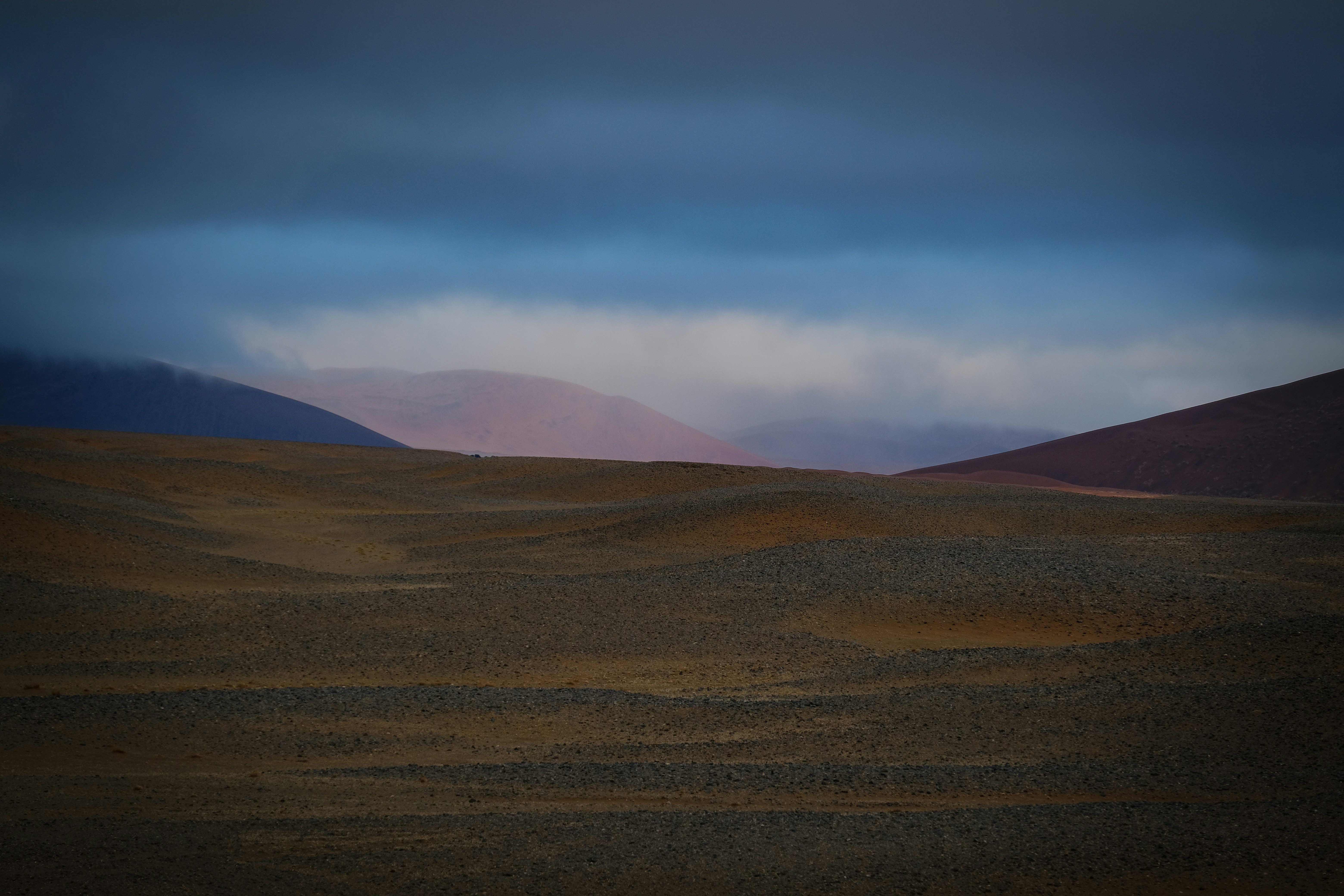 Deserted horizon under a bruised sky