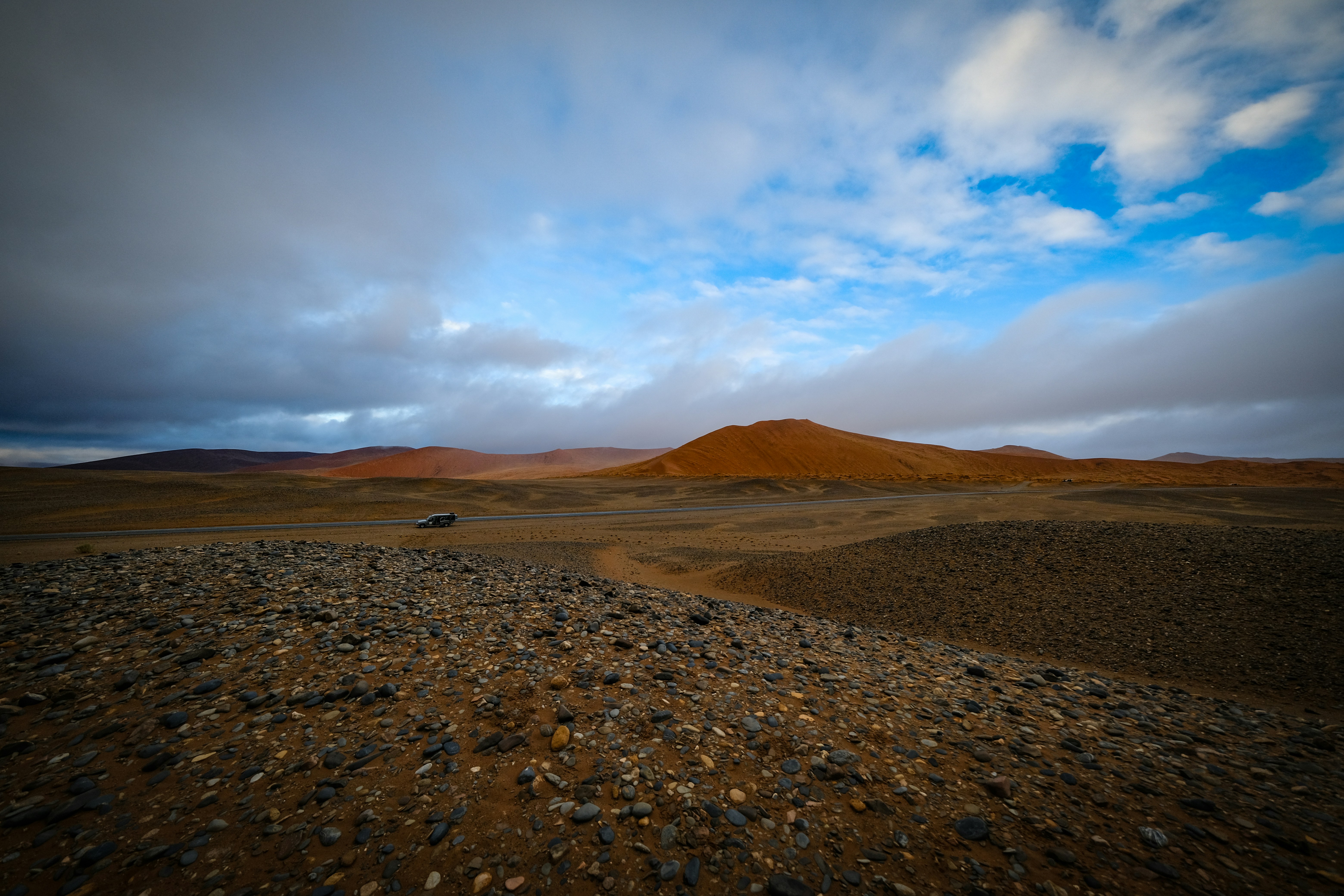Desert Ridge at Dusk: A Carved Horizon Beneath Quiet Clouds
