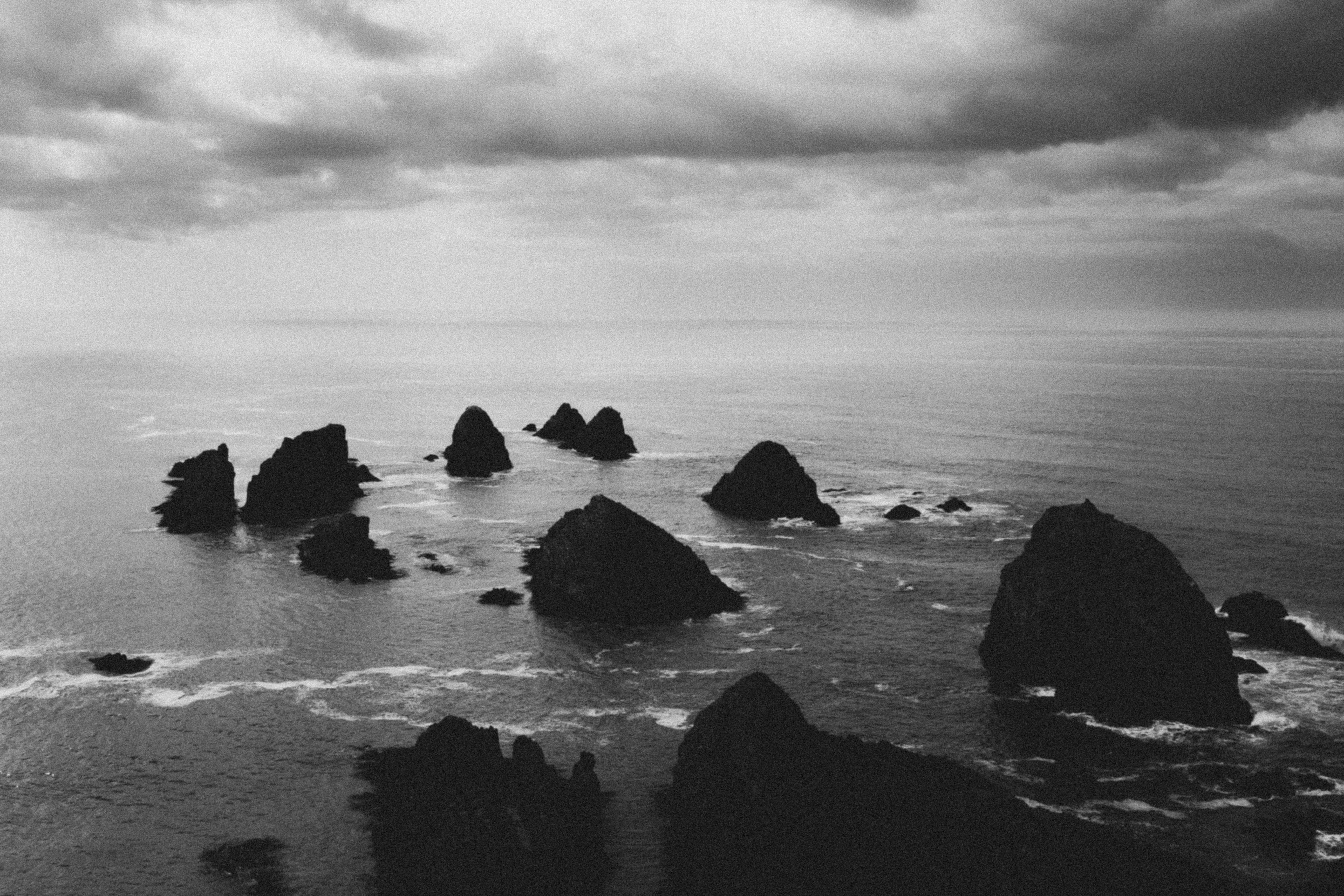 Sea Stacks in Gray Quiet, a Seaward Chain of Rocks Emerges from the Mist