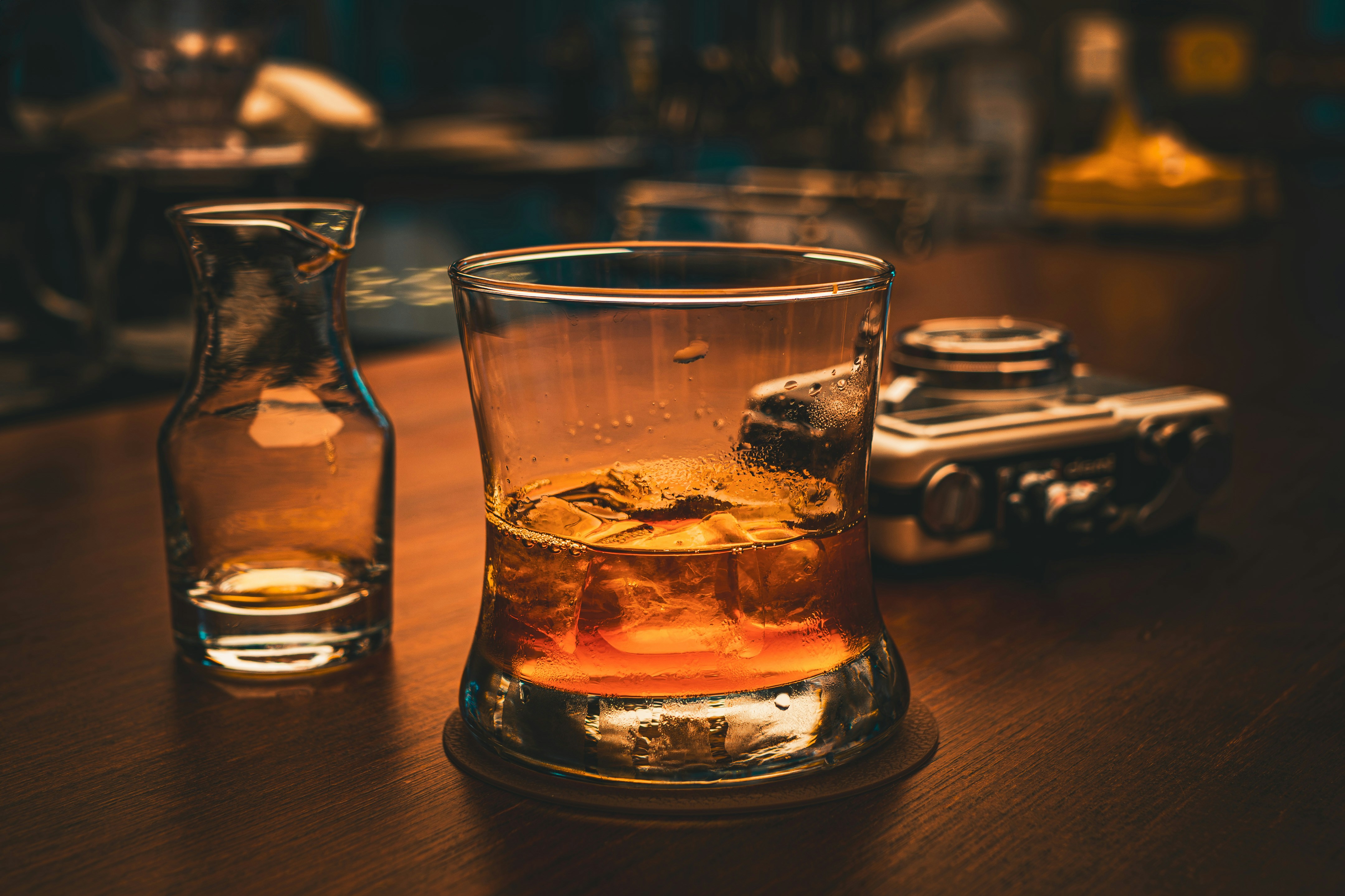 Amber Glass on a Quiet Bar: A Moment Stilled in Time