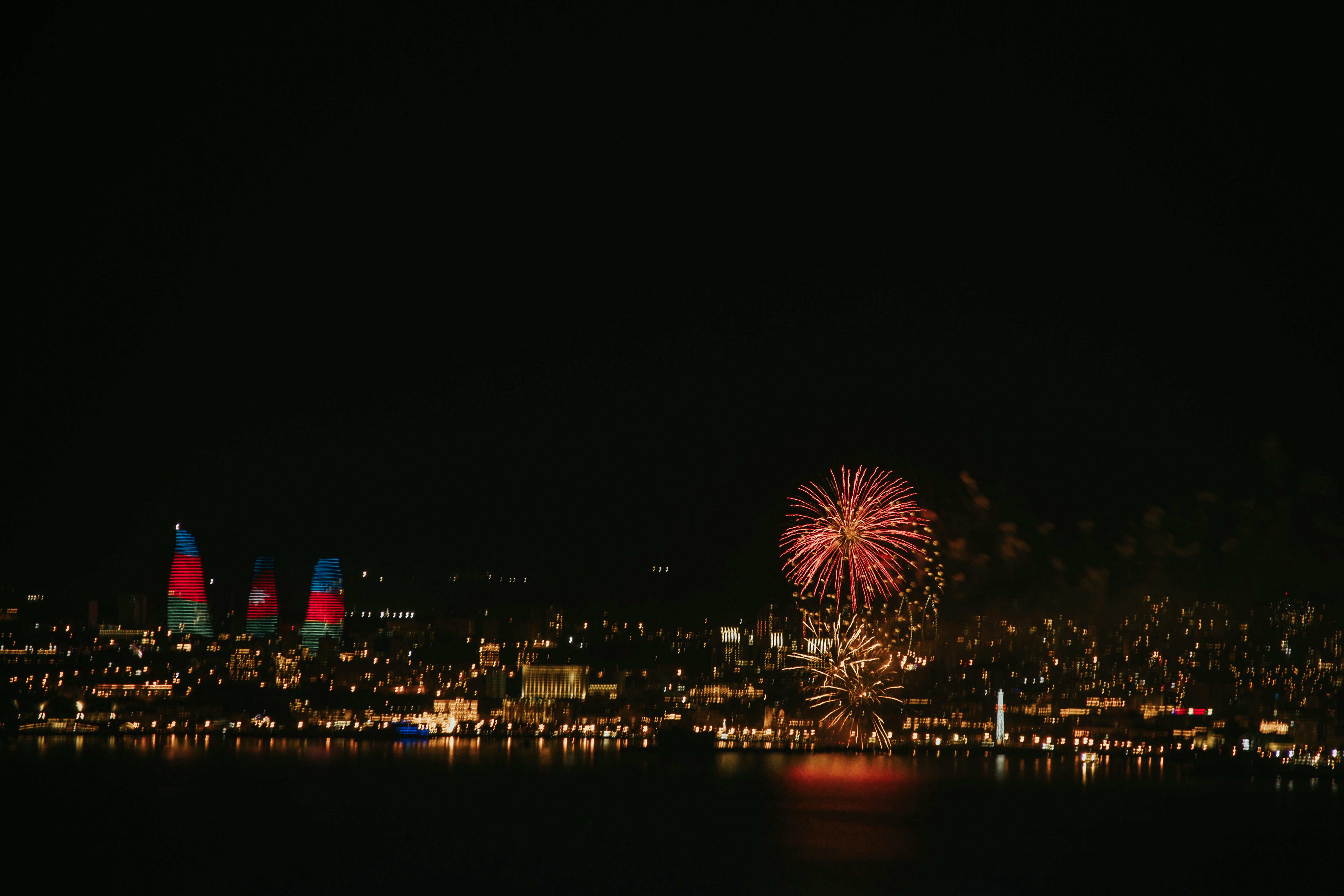 Firework Bloom Over a Resting Skyline