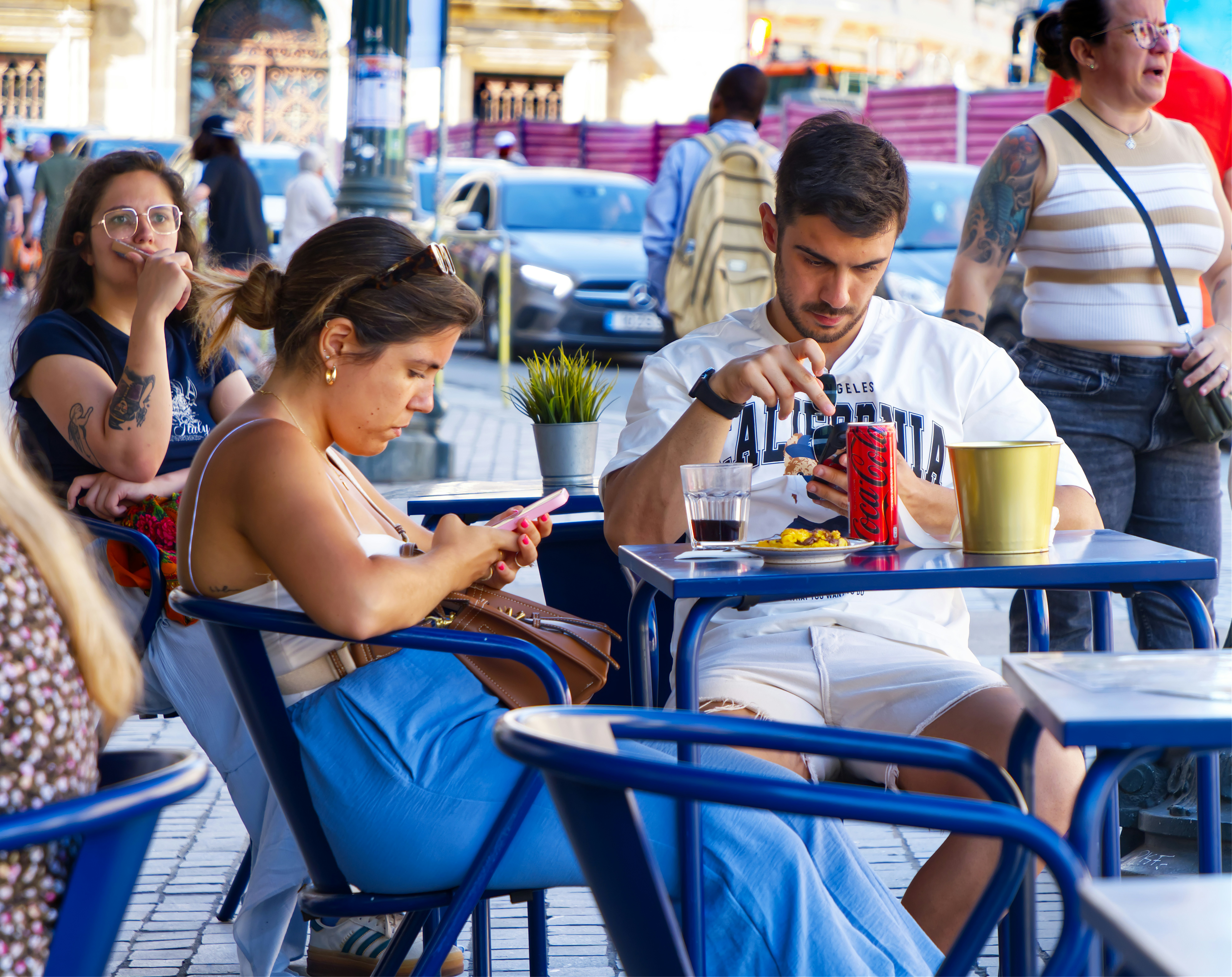 Cafe Terrace Focus: A Couple Share a Moment at the City Table