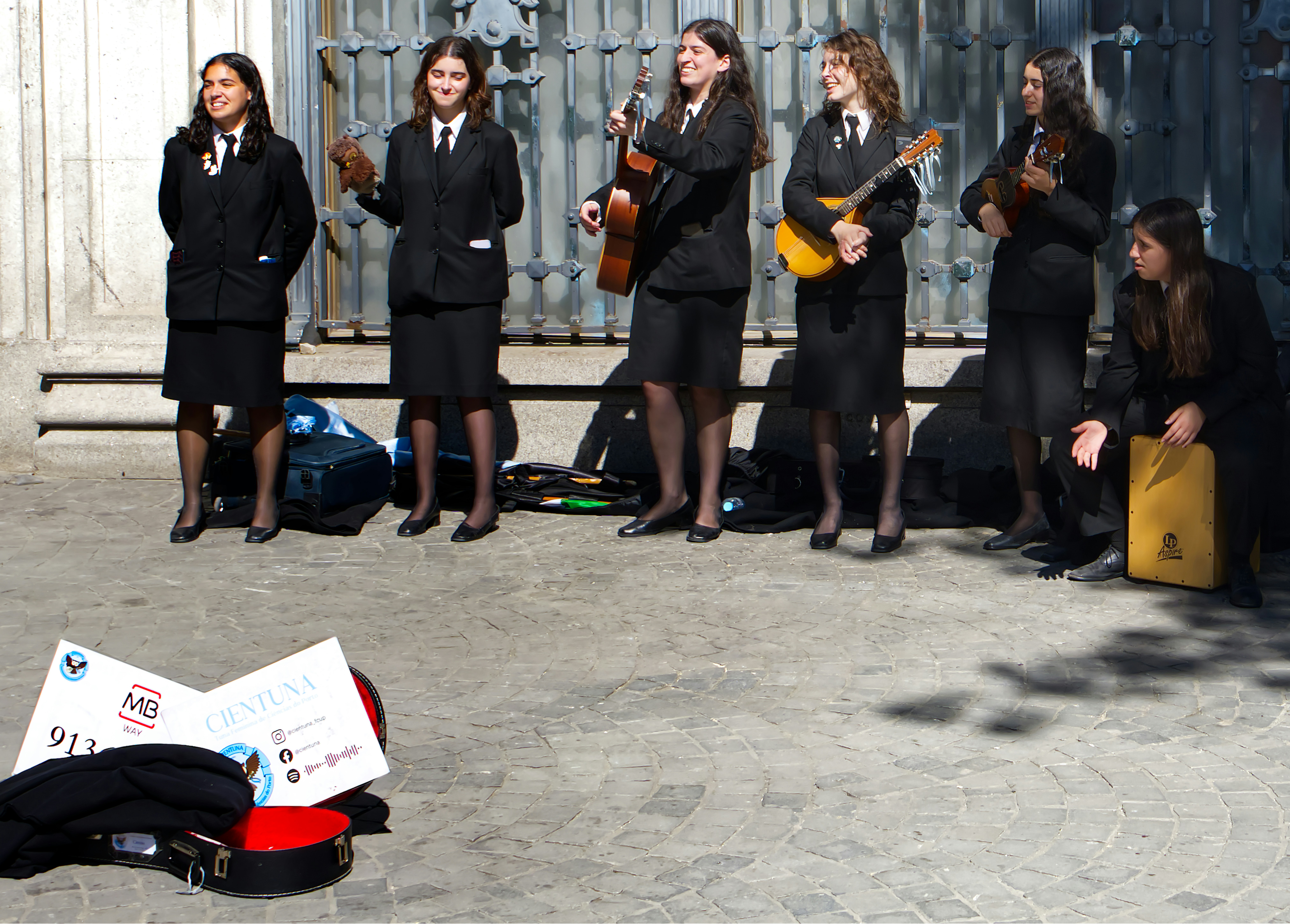 Guitar Strings on a Stone Stage: Schoolgirls busking session