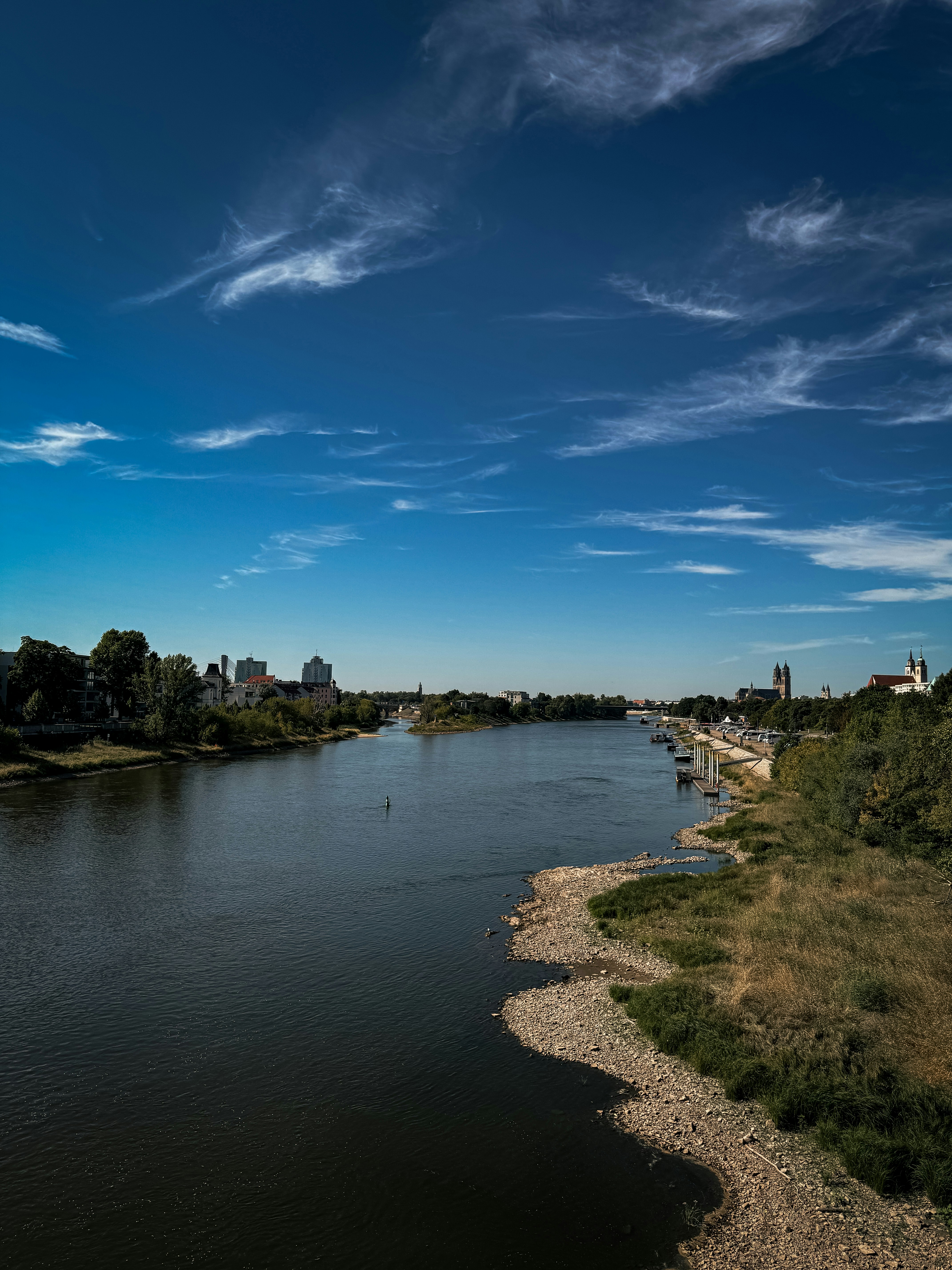 River Ahead: A Quiet Riverside Corridor Under Open Skies