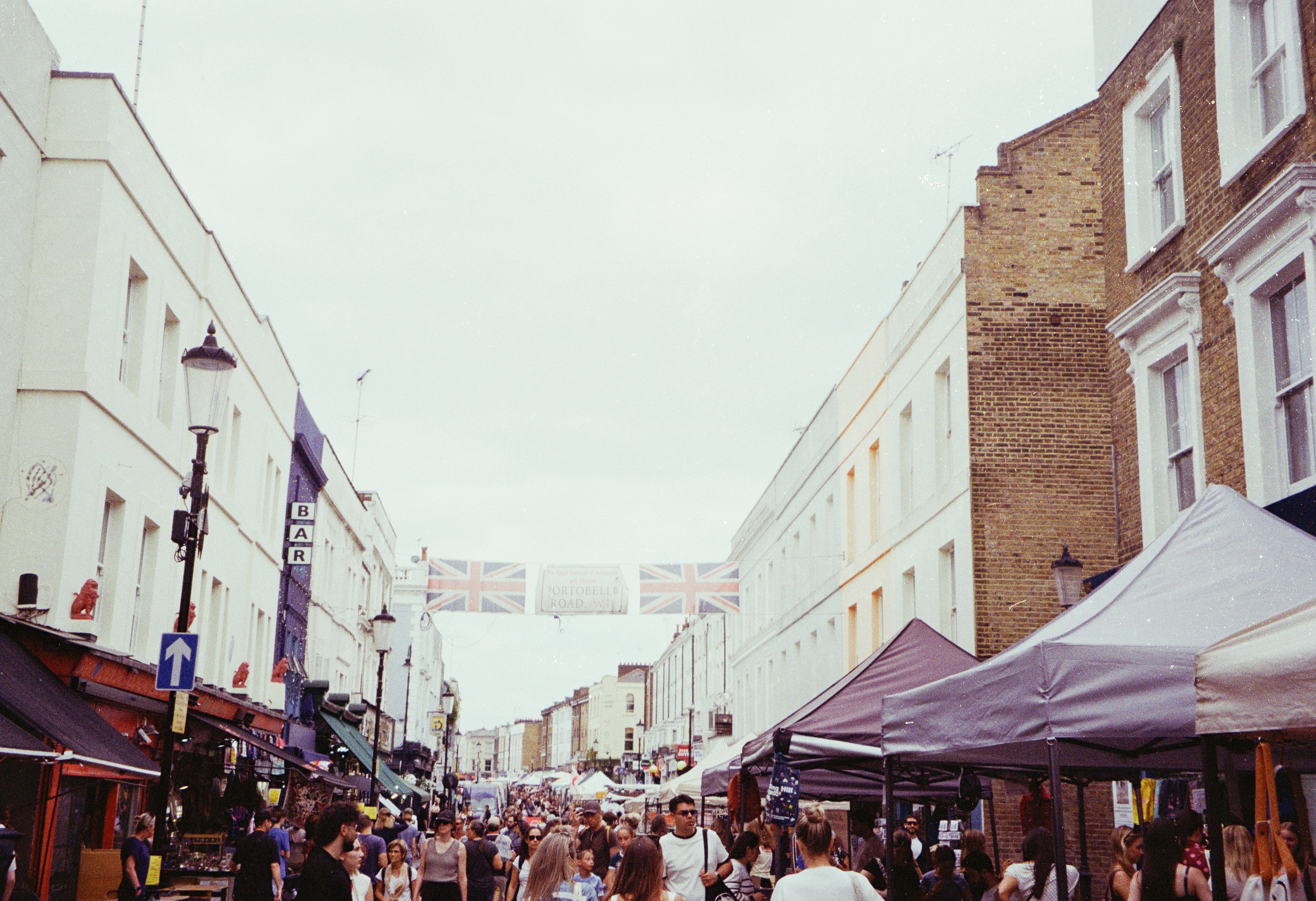 Market Street in Bloom: Union Jack Banners above a Busy Festival Lane