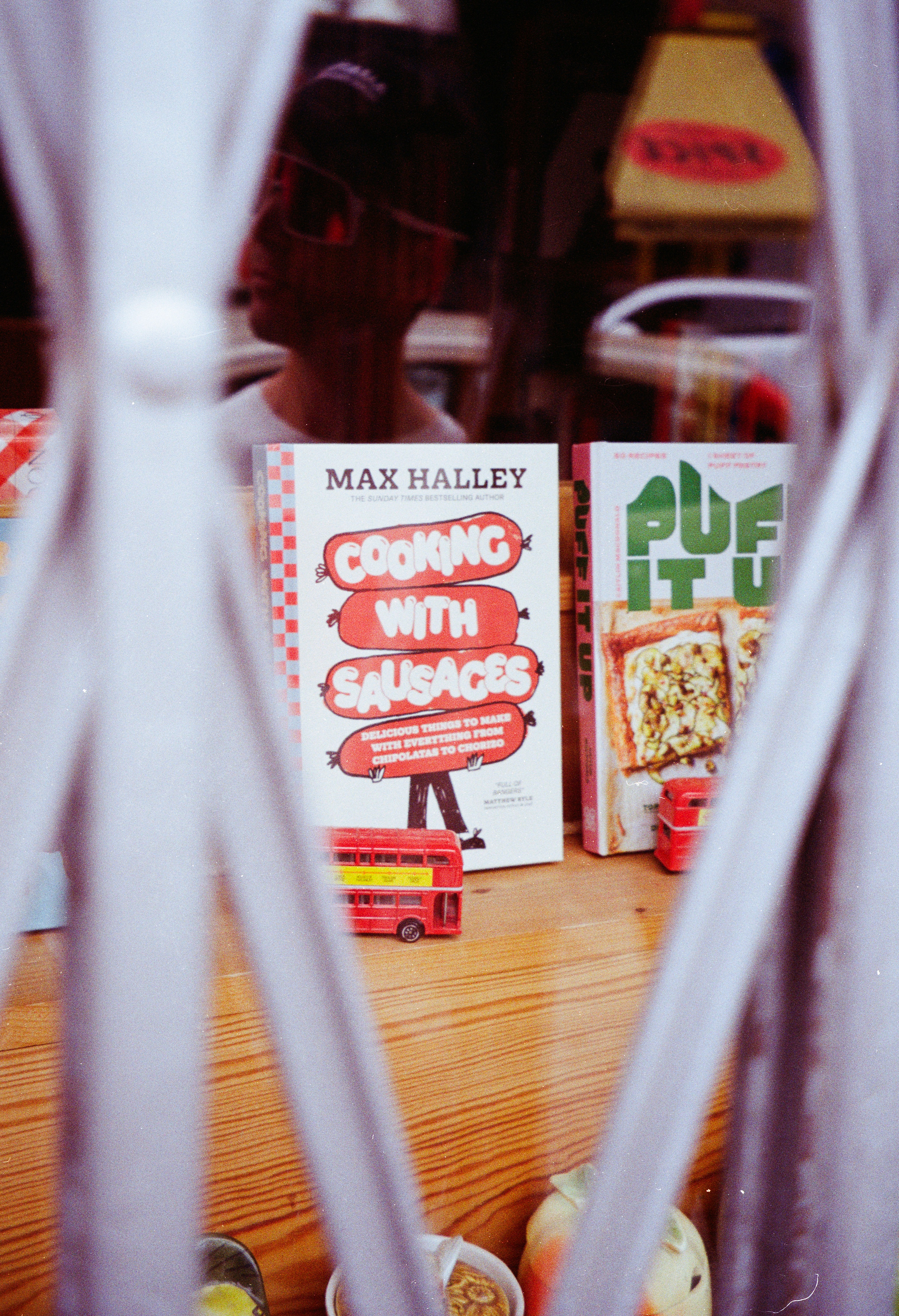 Shelf-side Spotlight: A Retro Cookbook Display Through a Framed Window