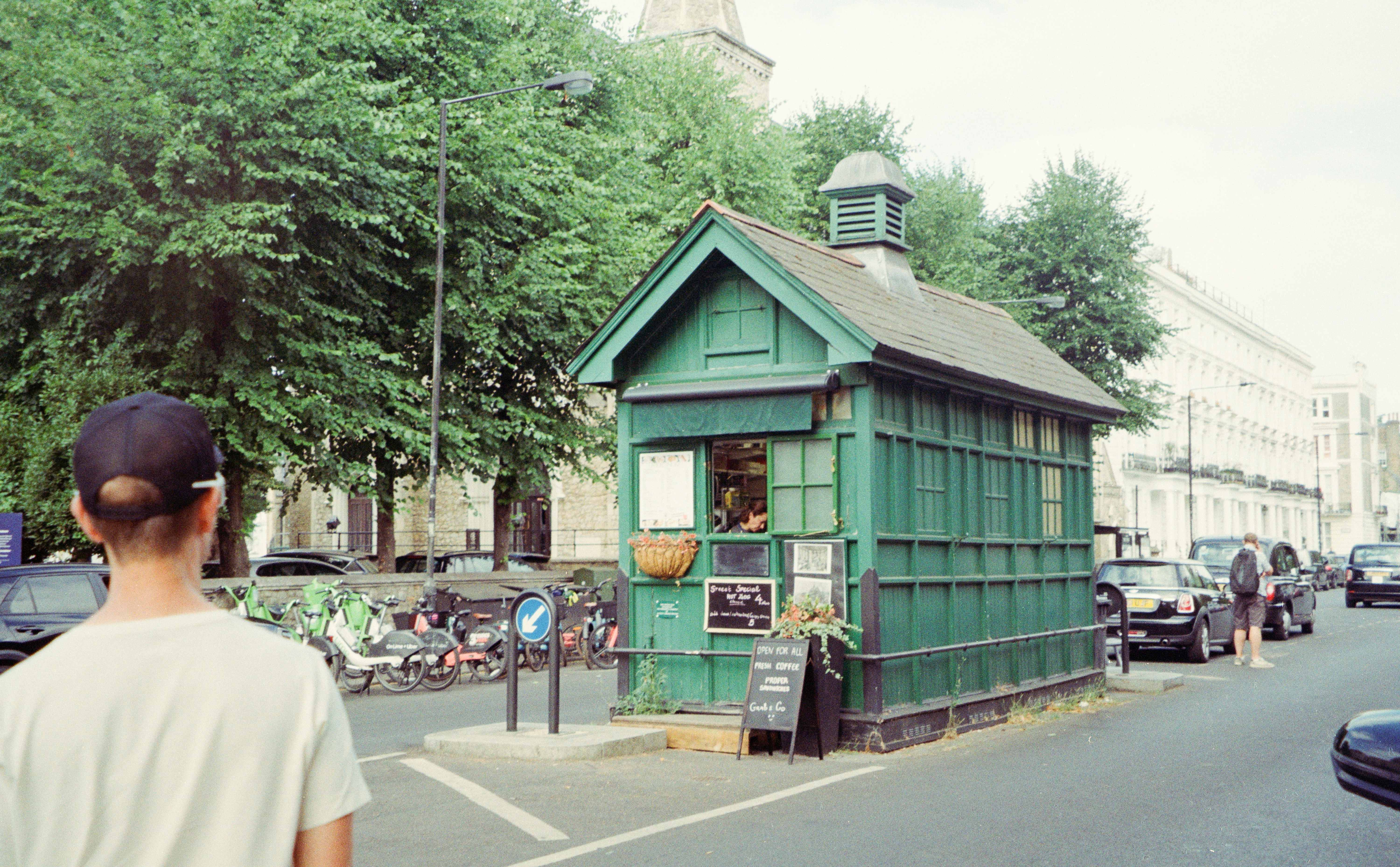 Green Kiosk on a Quiet City Corner