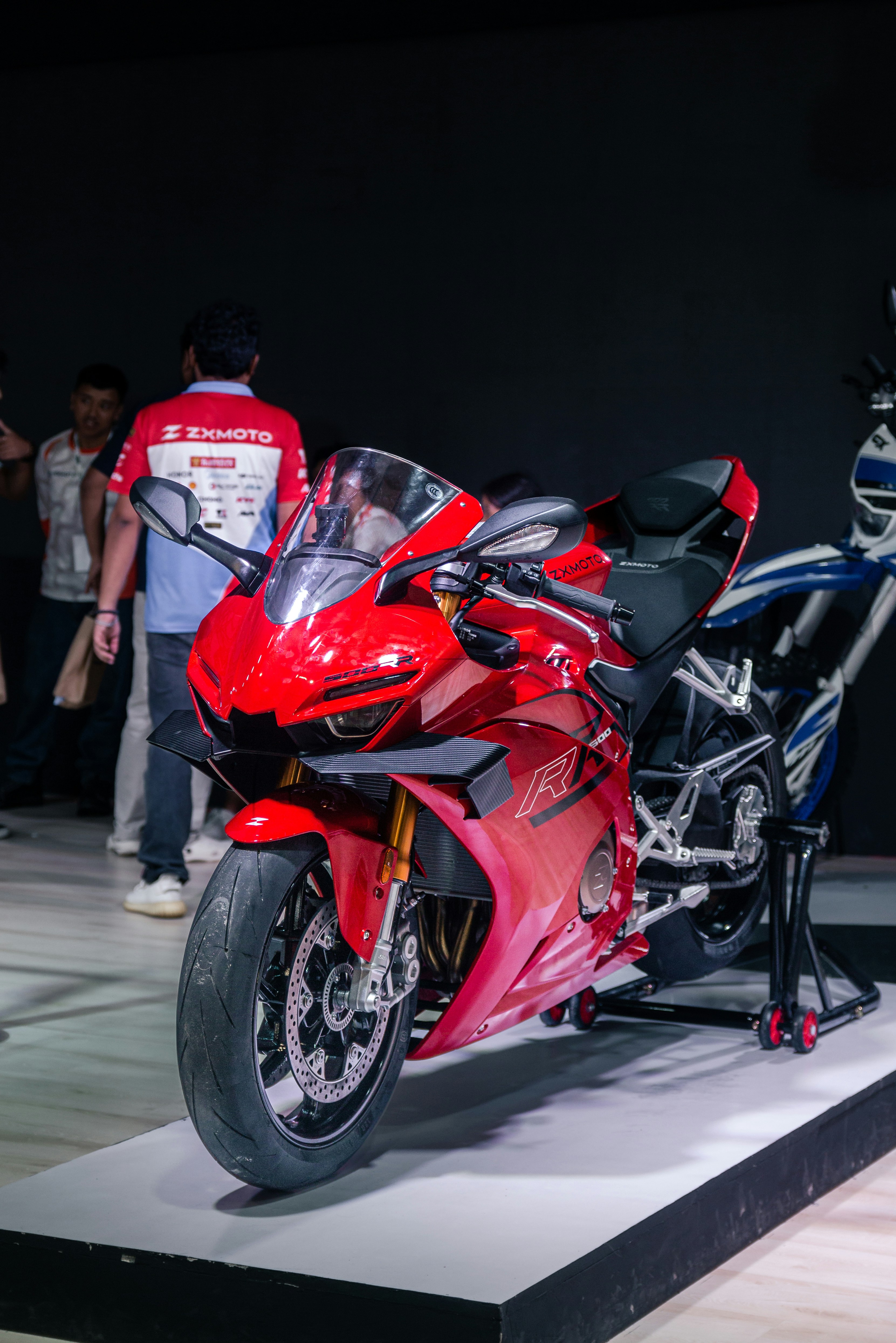 Red Thunder: A Ducati Panigale V2 on Display at a Motorcycle Show