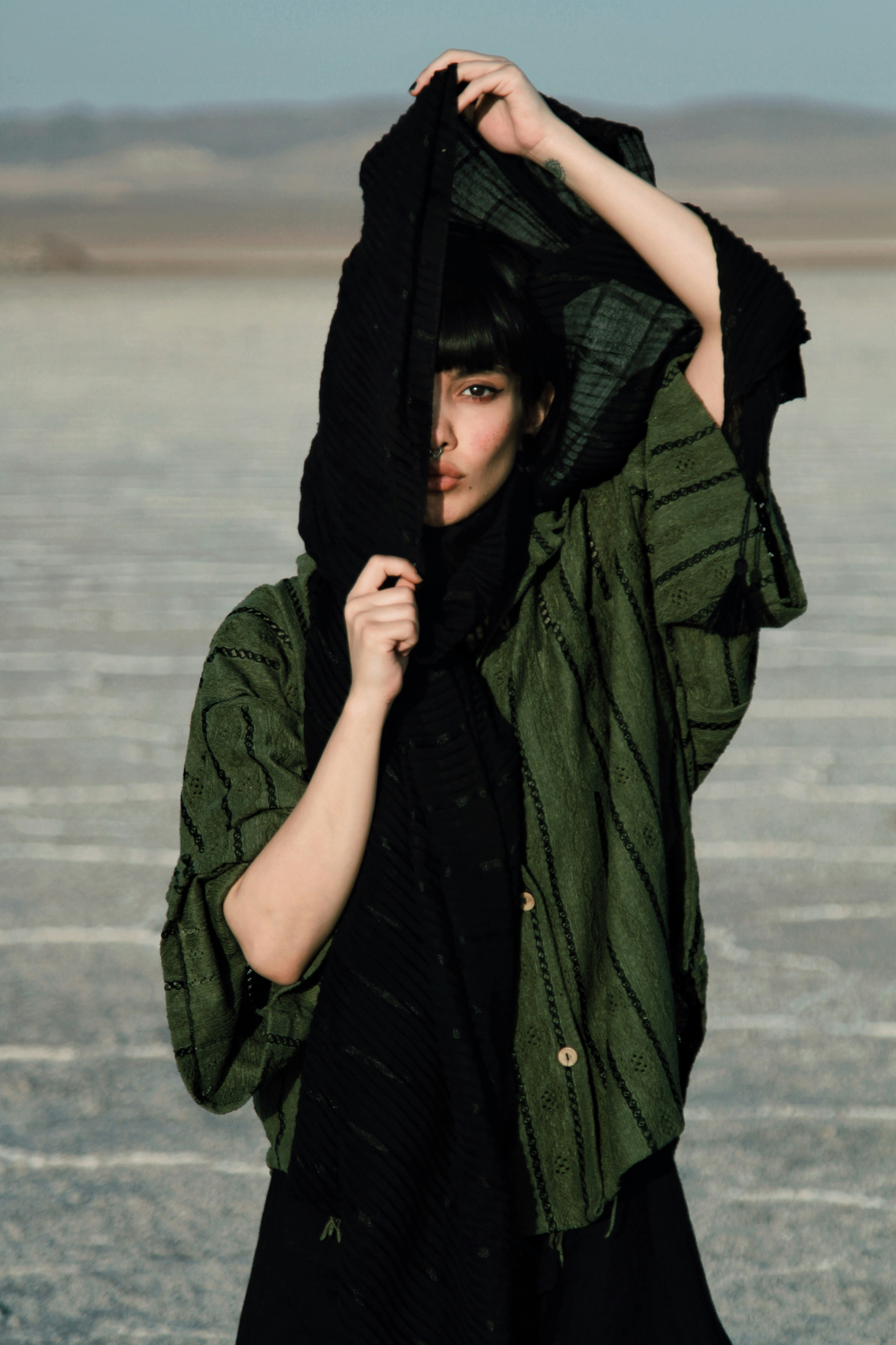 Veiled in Lines: A Portrait Beyond the Veil in a Dusty Artic Desert