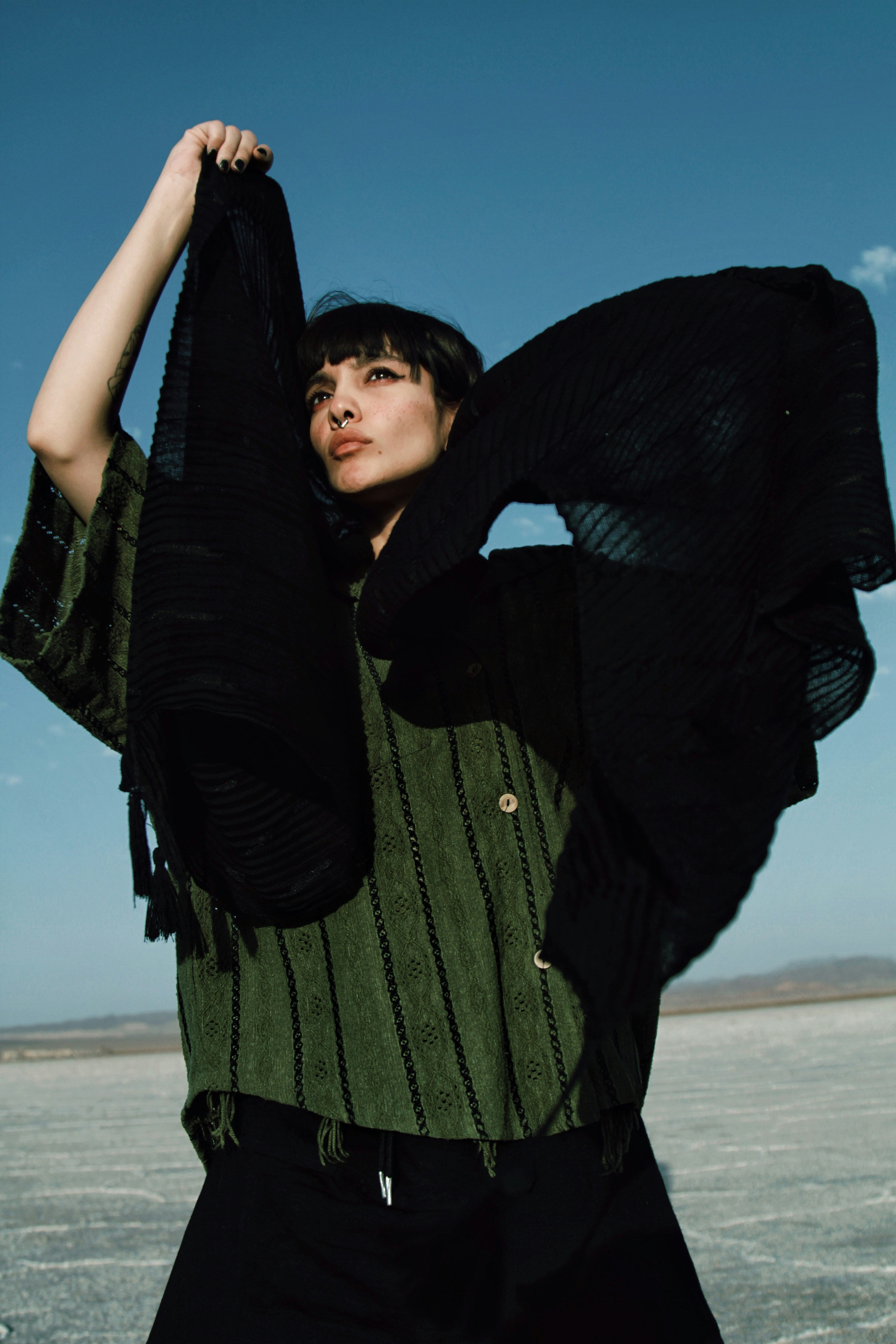 Against the Wind: A Green Knit under a Midnight Sky