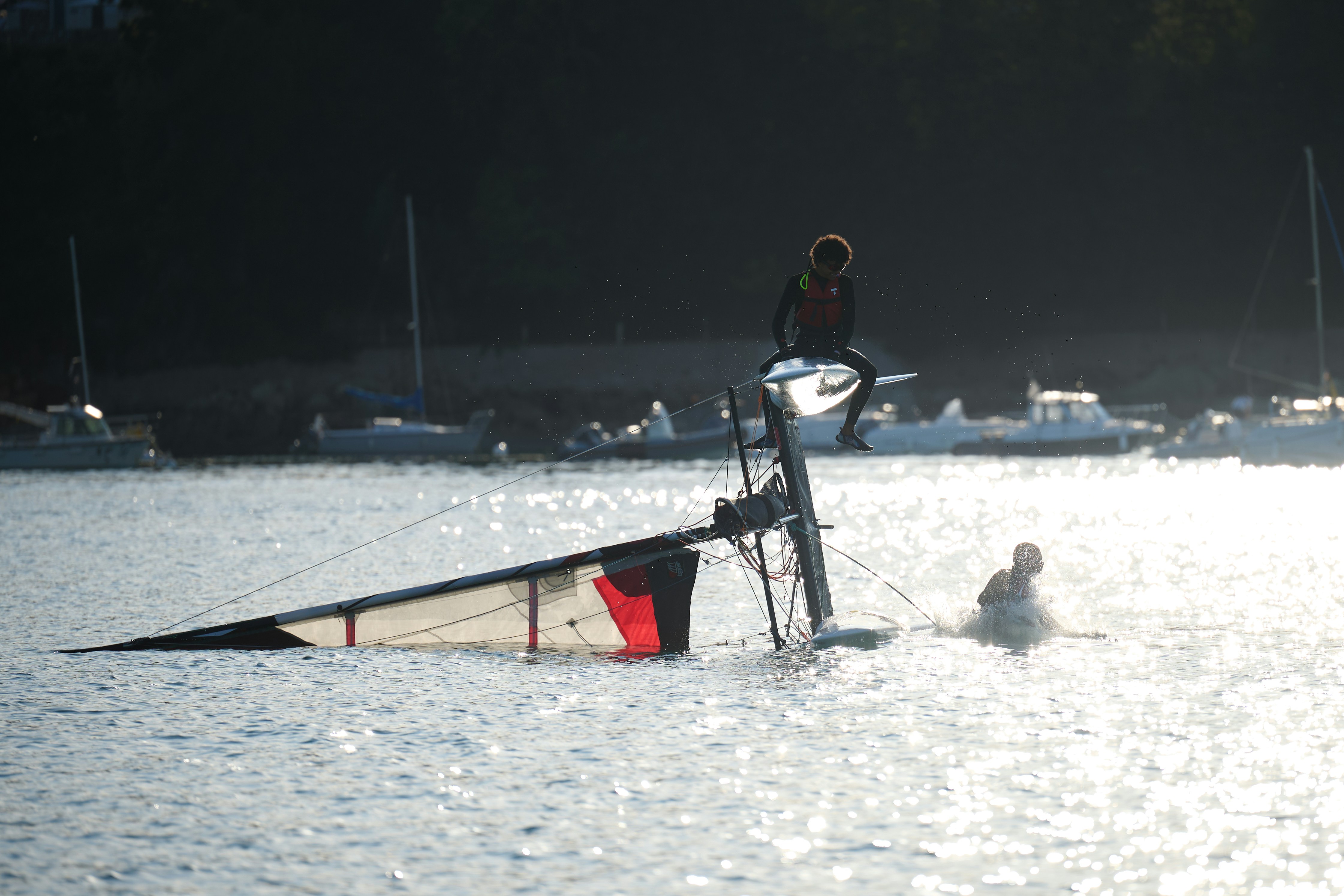 Sunlit Glider: A Wind-Washed Sailplane in Quiet Waters