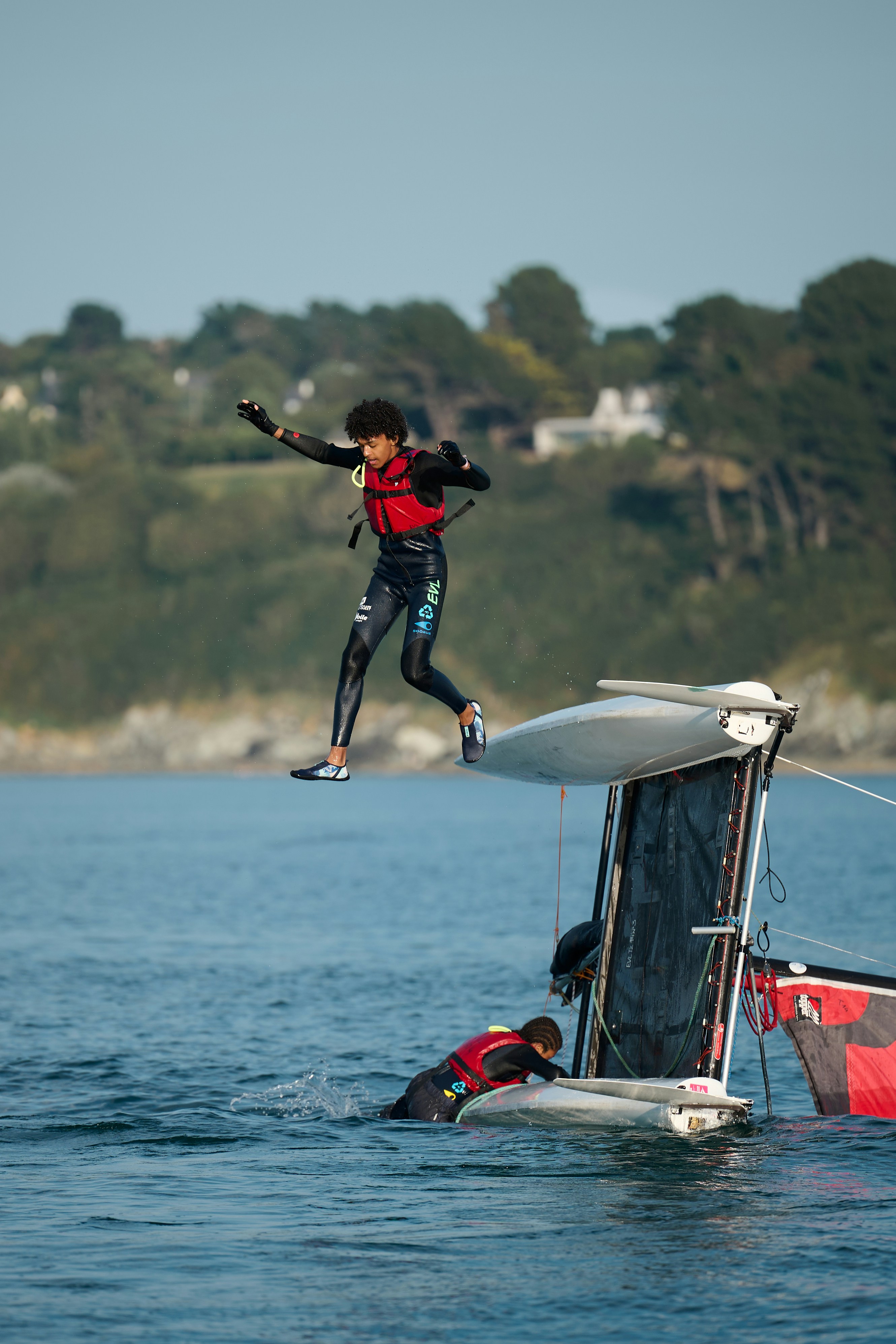 Jetting Off: A Surfer leaps from the stern toward the horizon