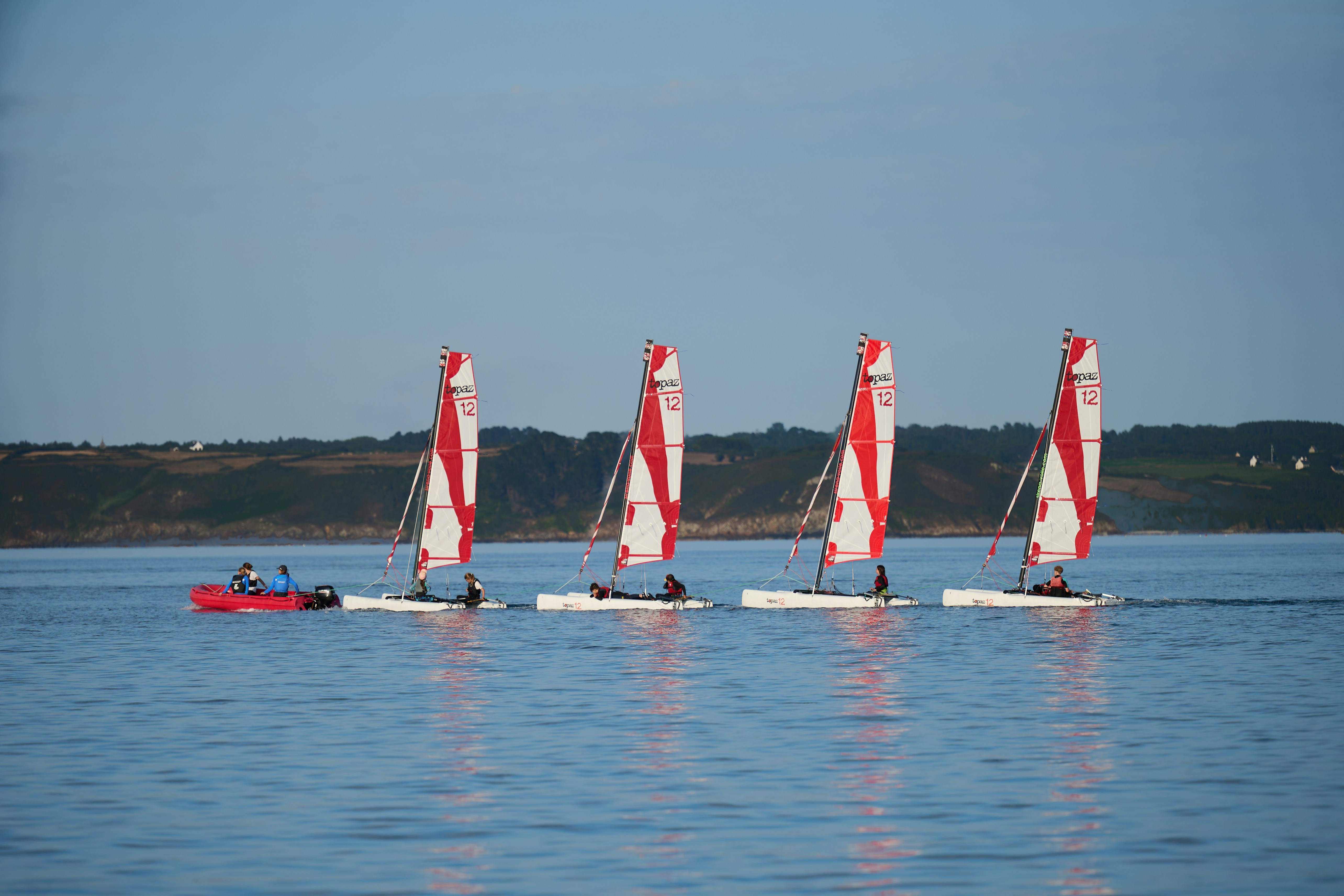 When the boating lesson is over, the teachers bring the catamarans back to the port.