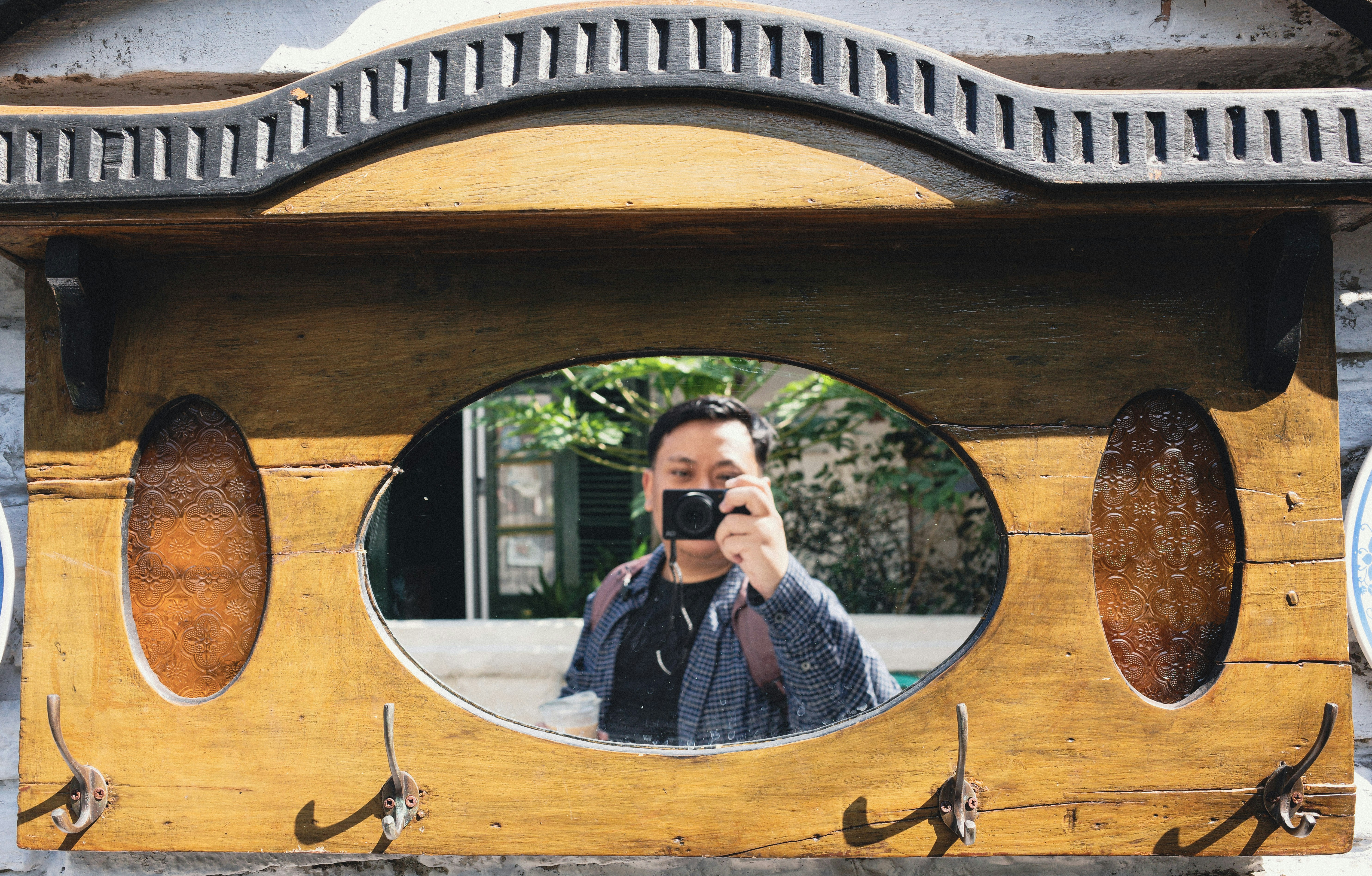 Round Window Portrait: Self-Reflection in Wood and Glass
