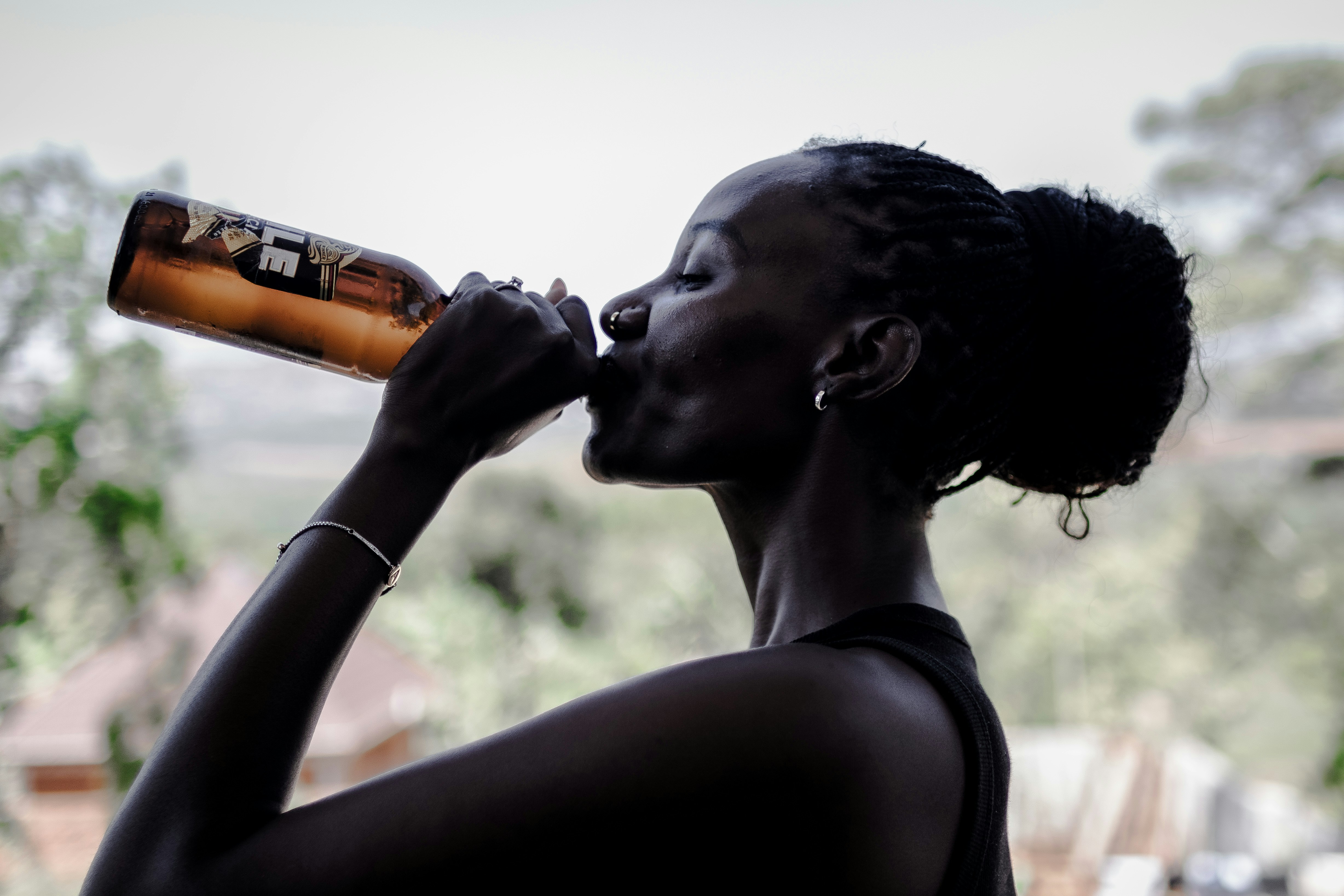 Silhouette of a Moment: A Gentle Sip in Soft Light