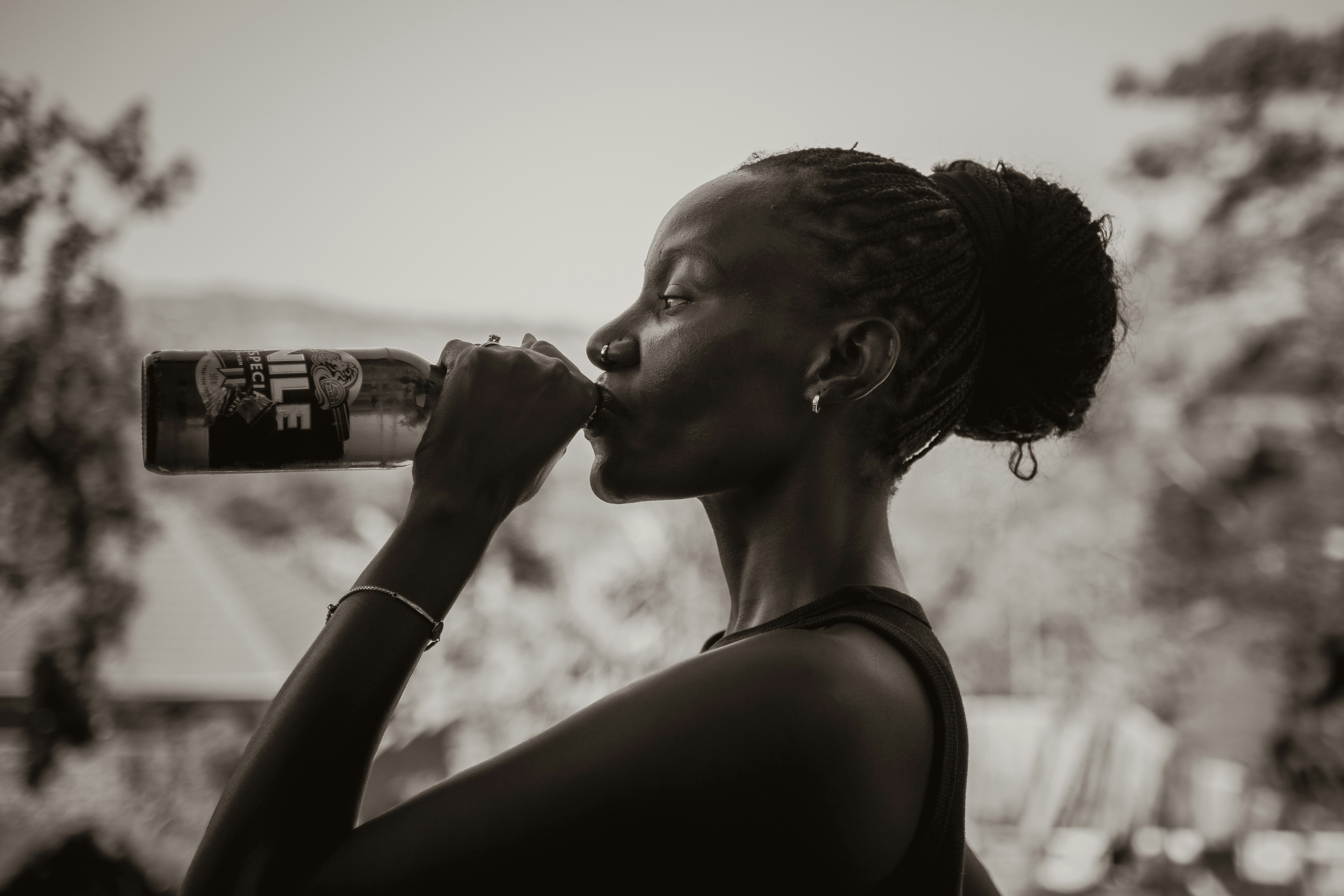 Profile in Focus: A Quiet Moment with a Bottle in Hand