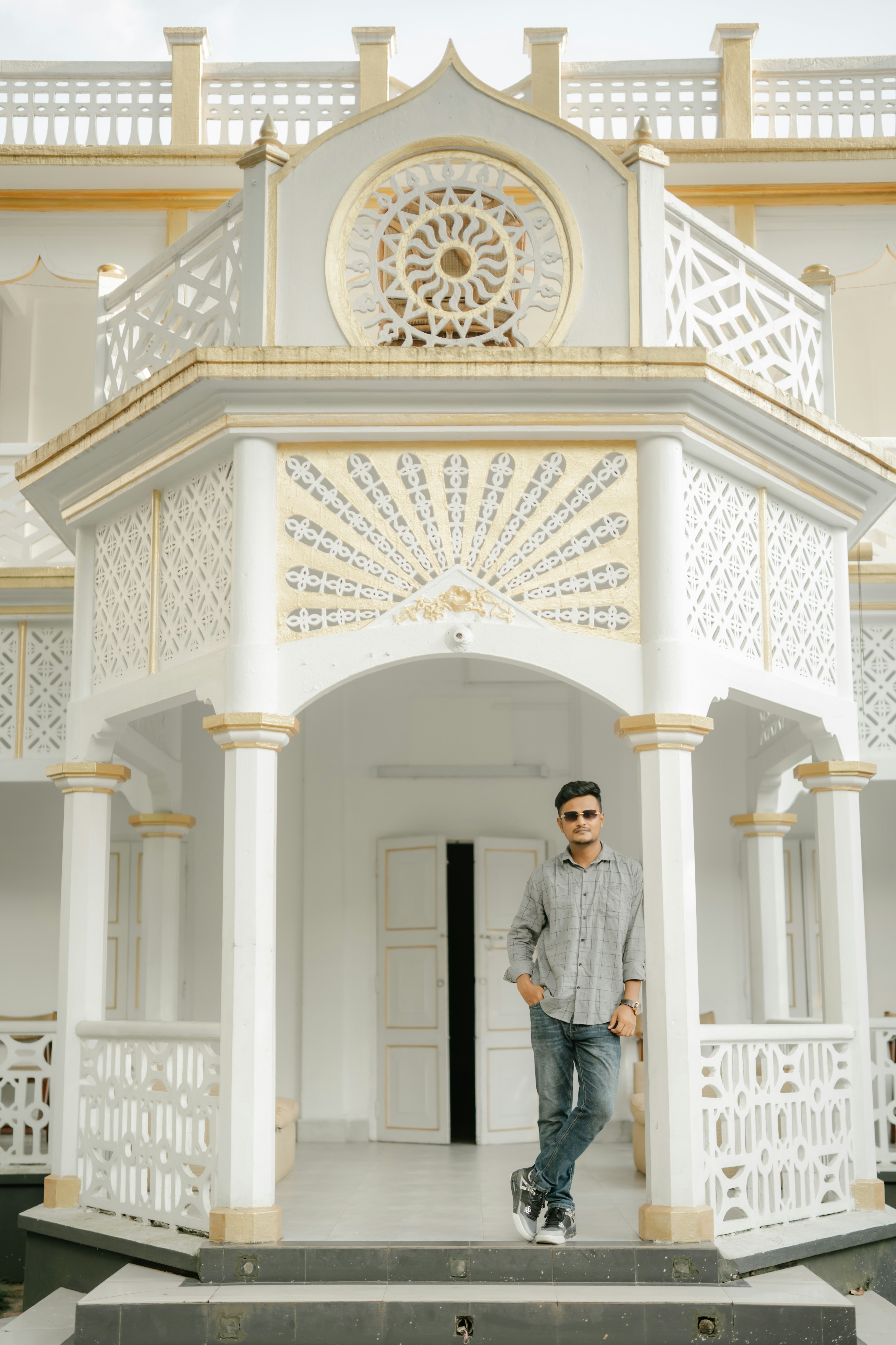 Sunlit Terrace Portrait at a White-Detailed Pavilion